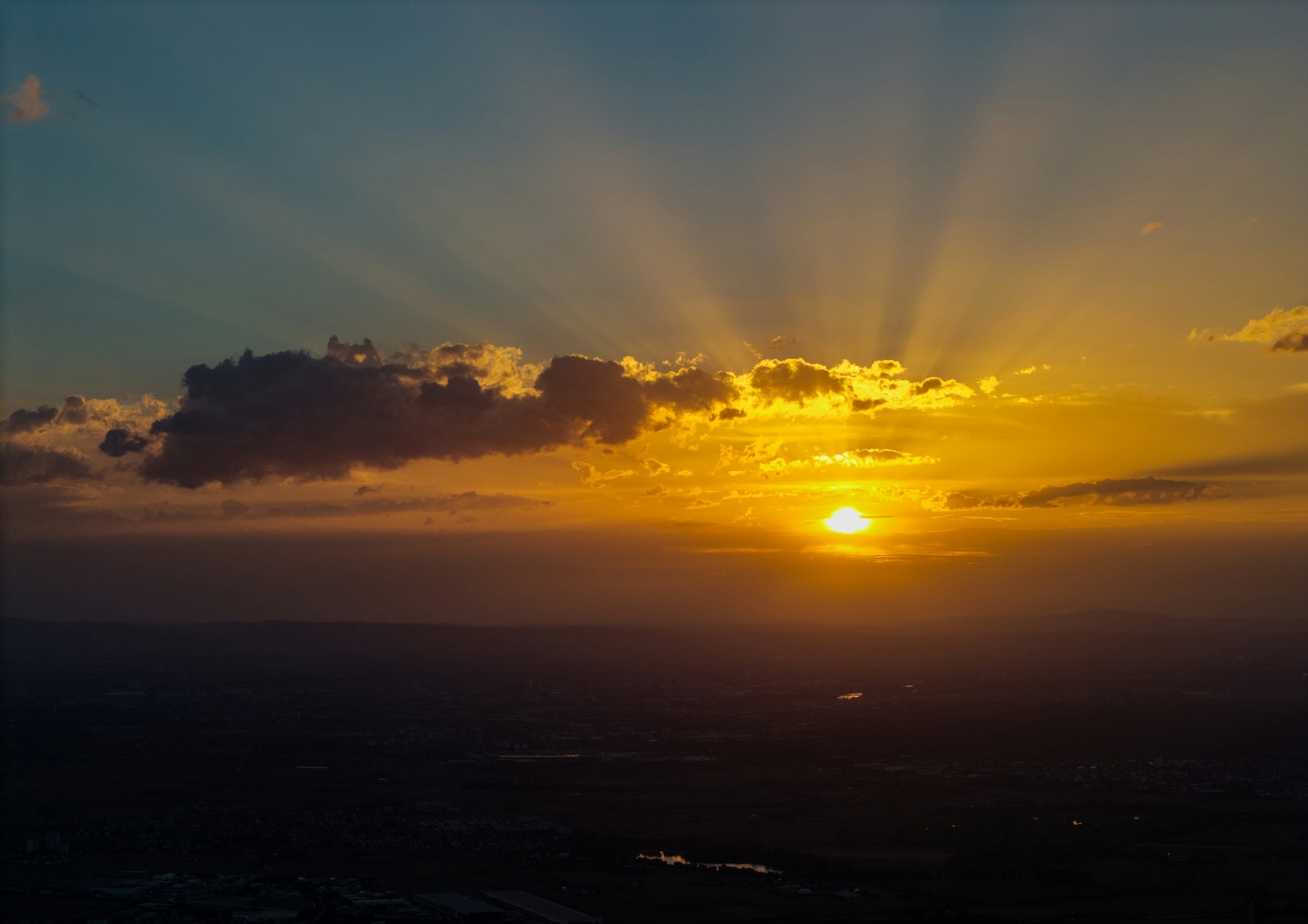 Dawn's Radiant Crest: Sunburst Over the Horizon