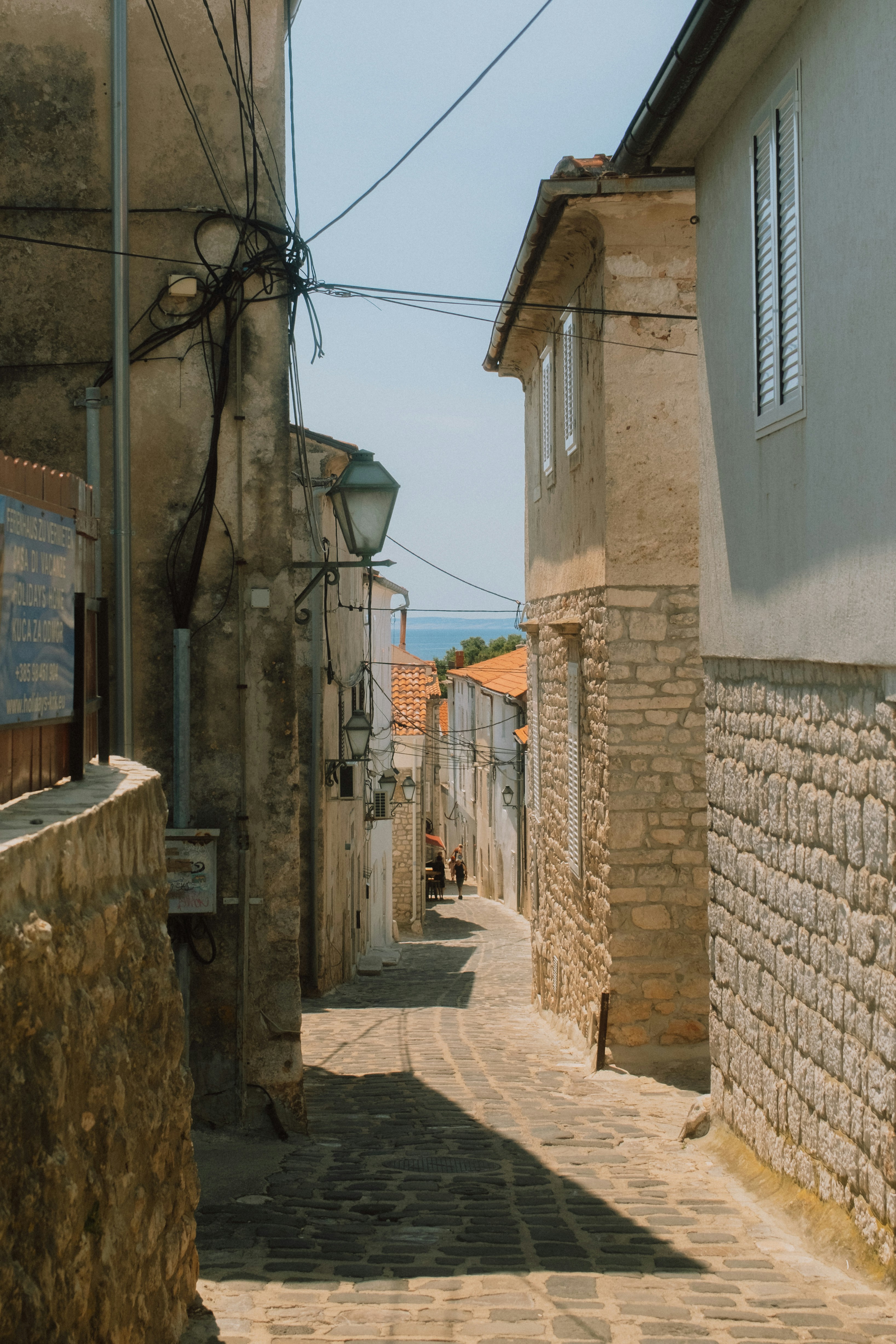 Sunlit Alleyway Toward the Sea