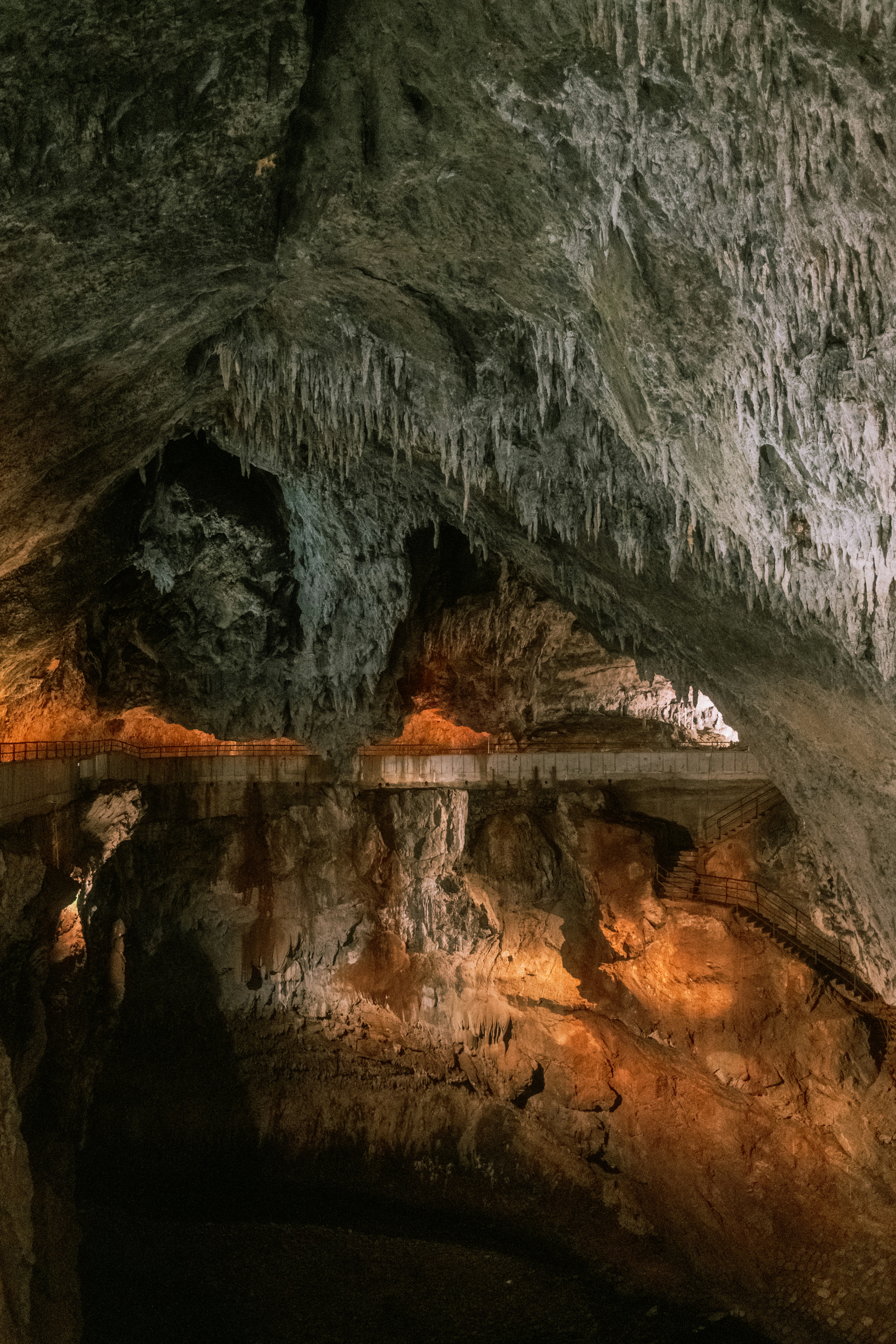 Whispering Stalactites Over a Lantern-lit Gorge Walkway