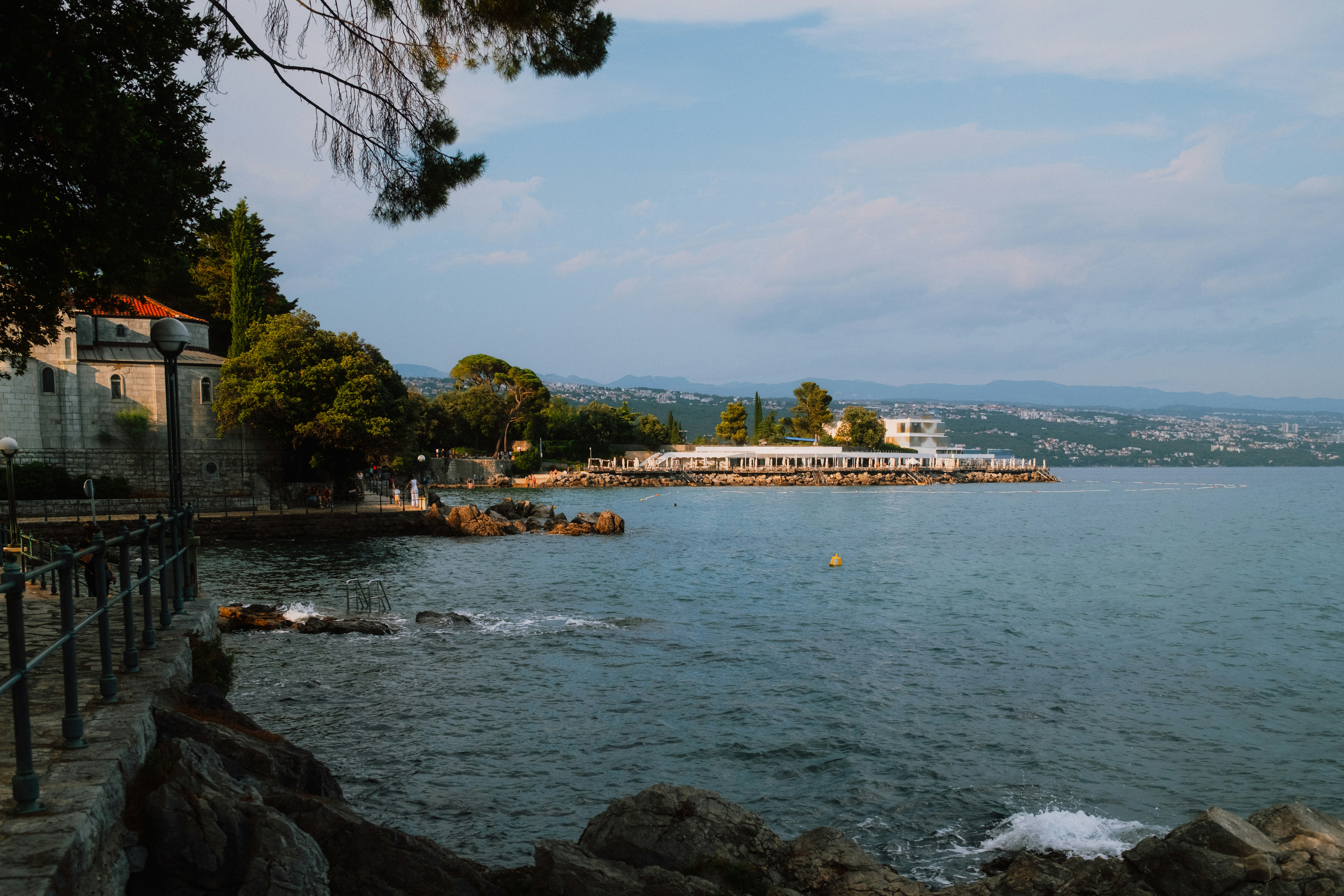 Lakeside promenade bathed in late afternoon light