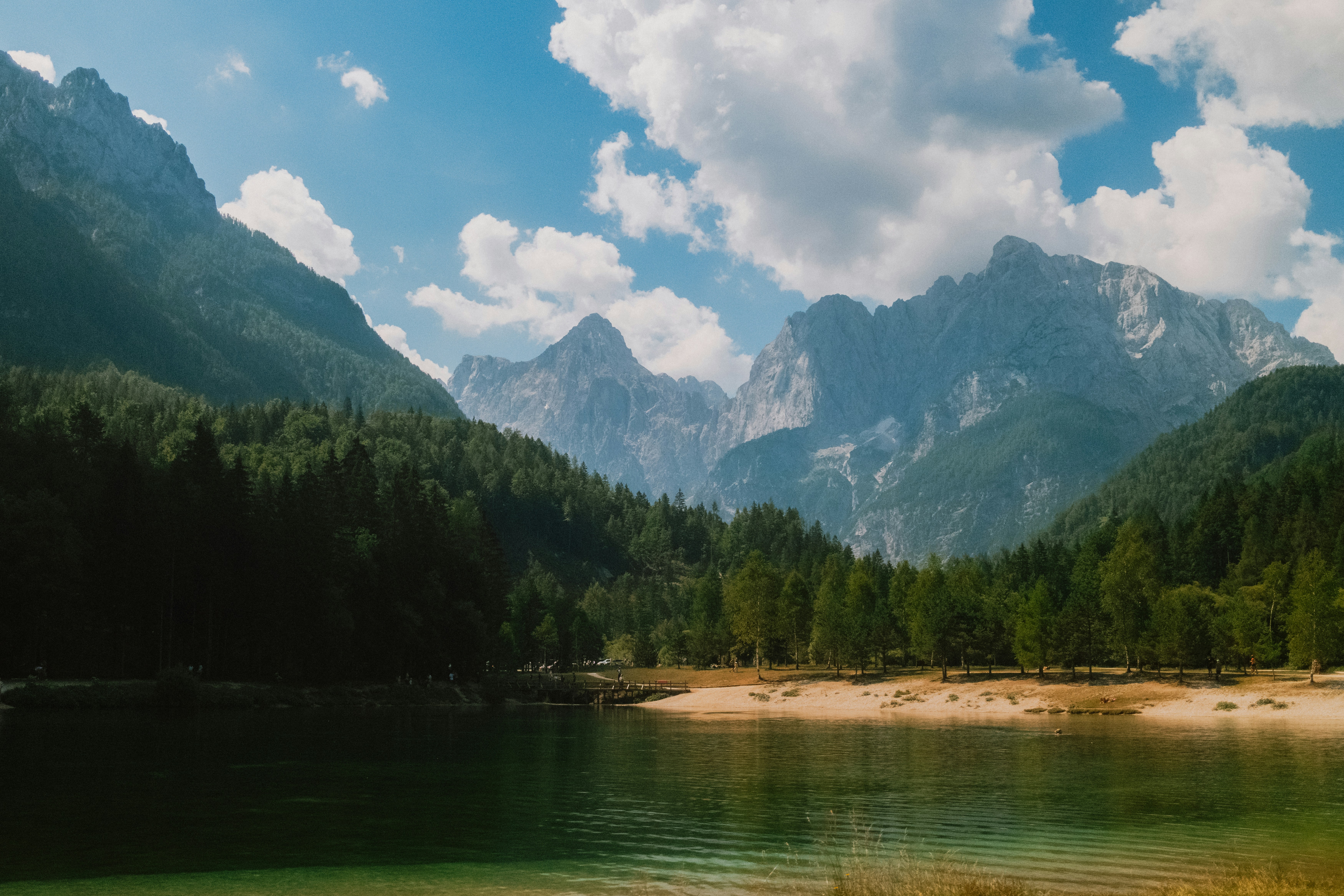 Shoreline Serenade: Mountain Ridge Beneath a Plush Sky