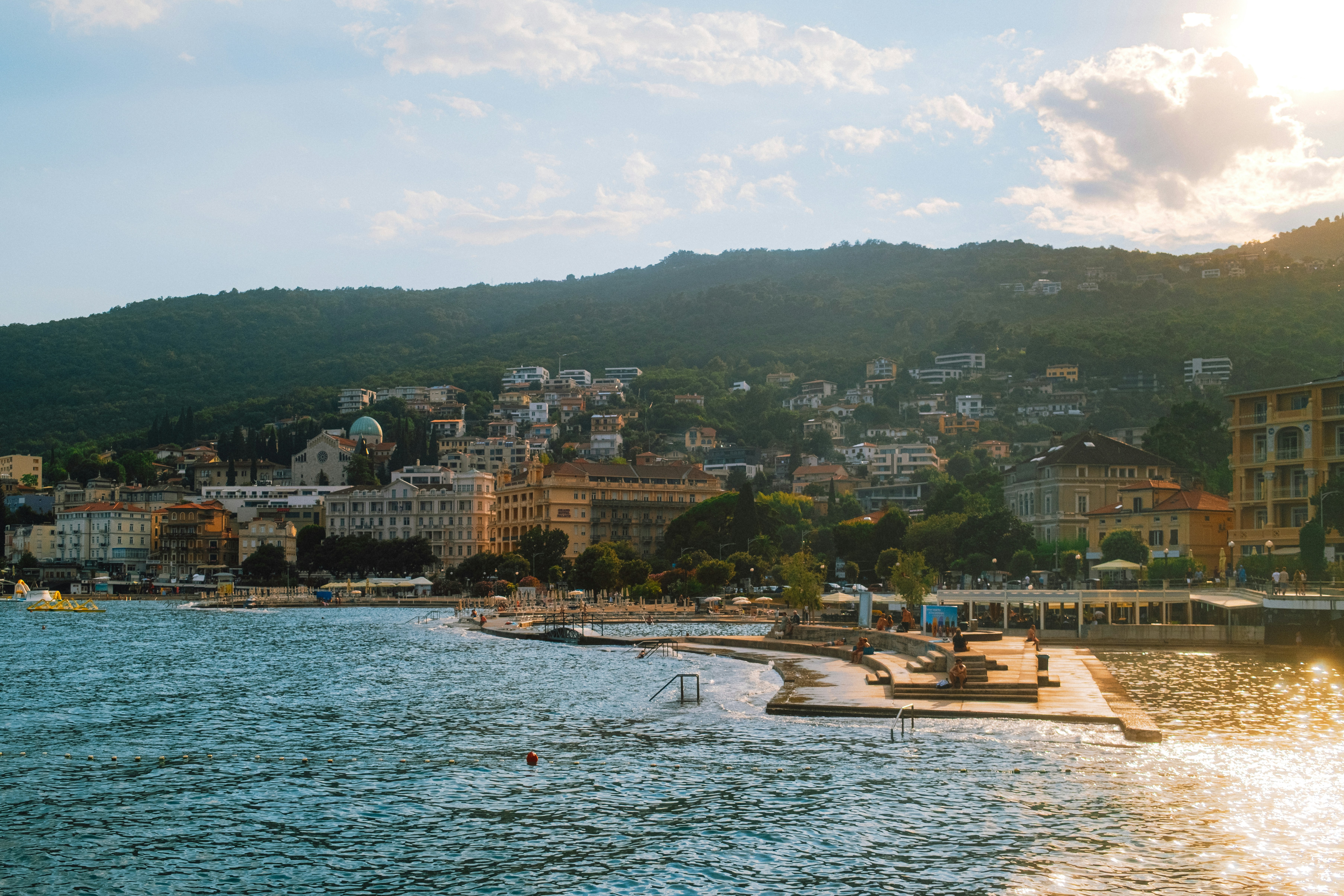 Harbor Terrace at Dusk: A Coastal Town Basking in Golden Light