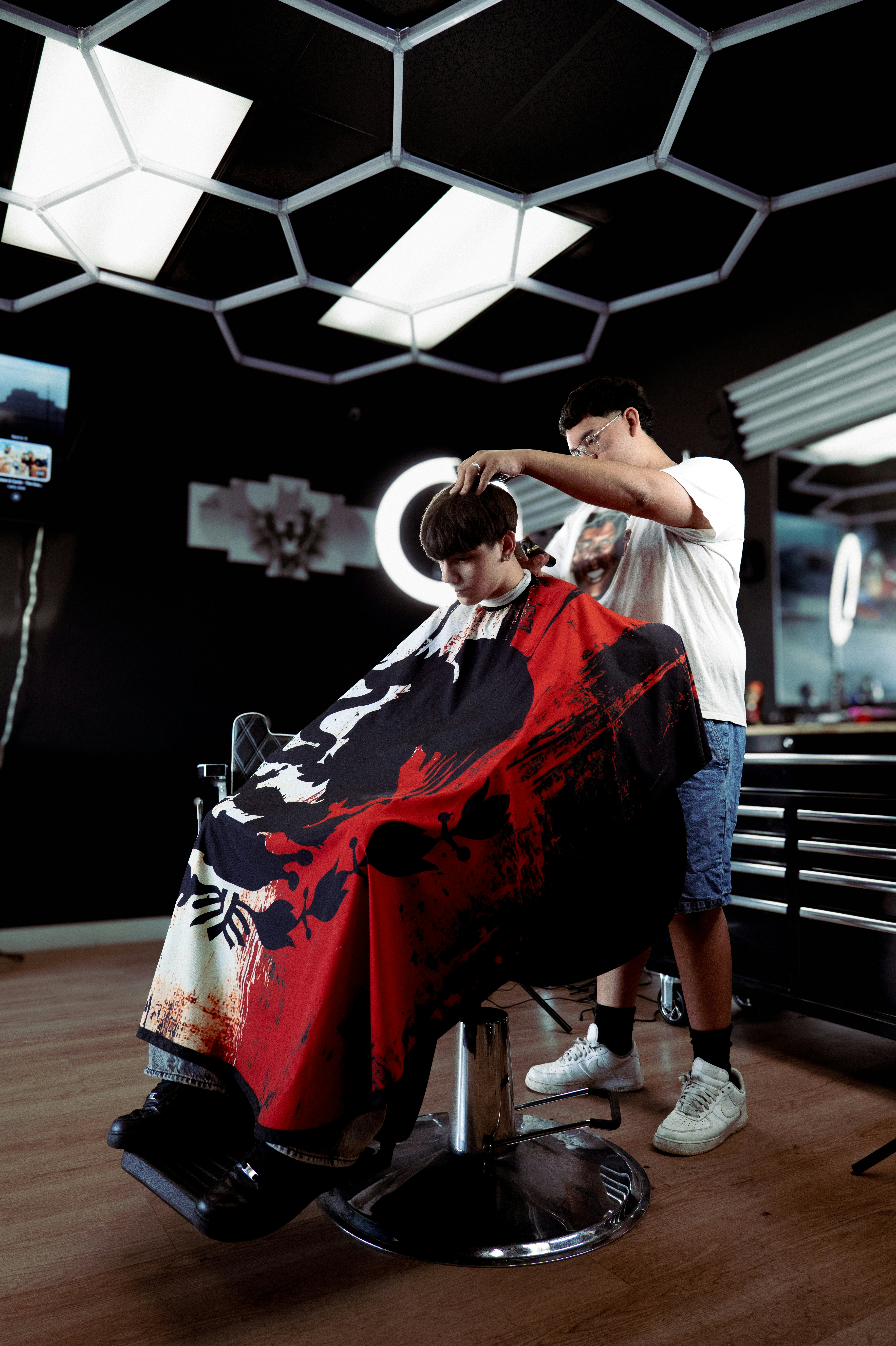 Neon Ringlights and Shears: A Barber Cut Silhouette