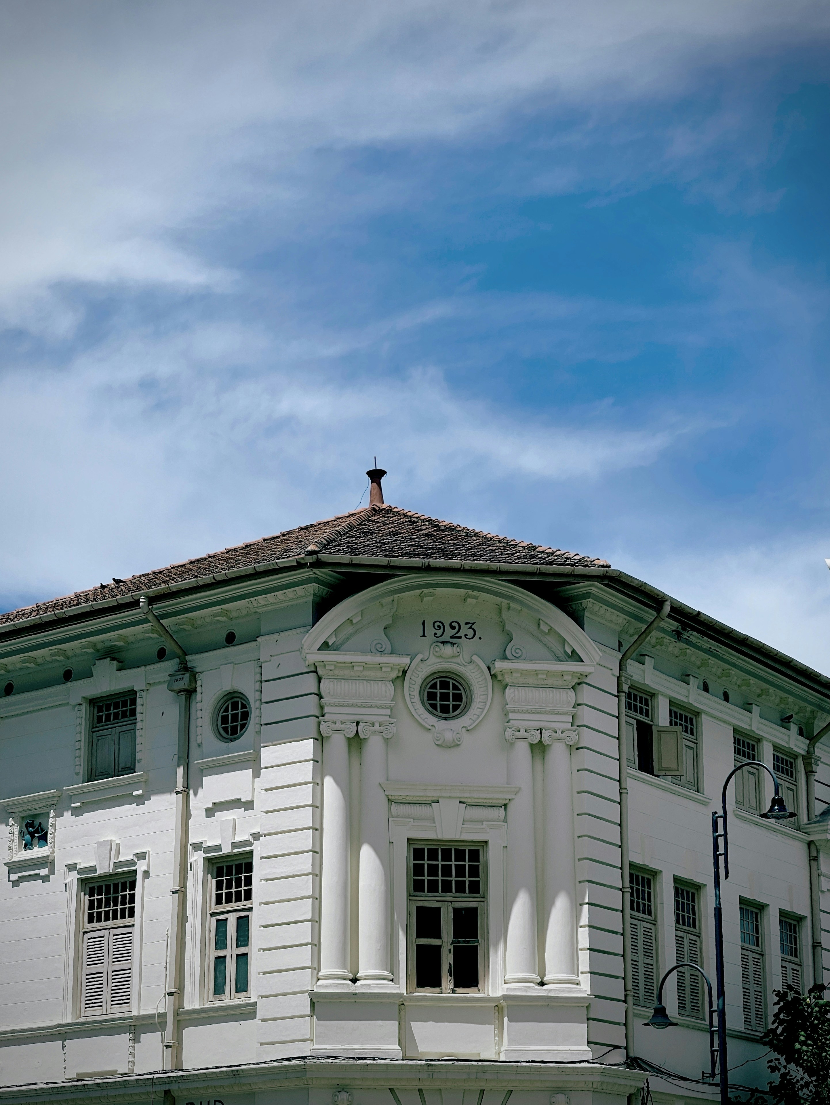Architectural Crest: A Classical Facade Under Open Sky