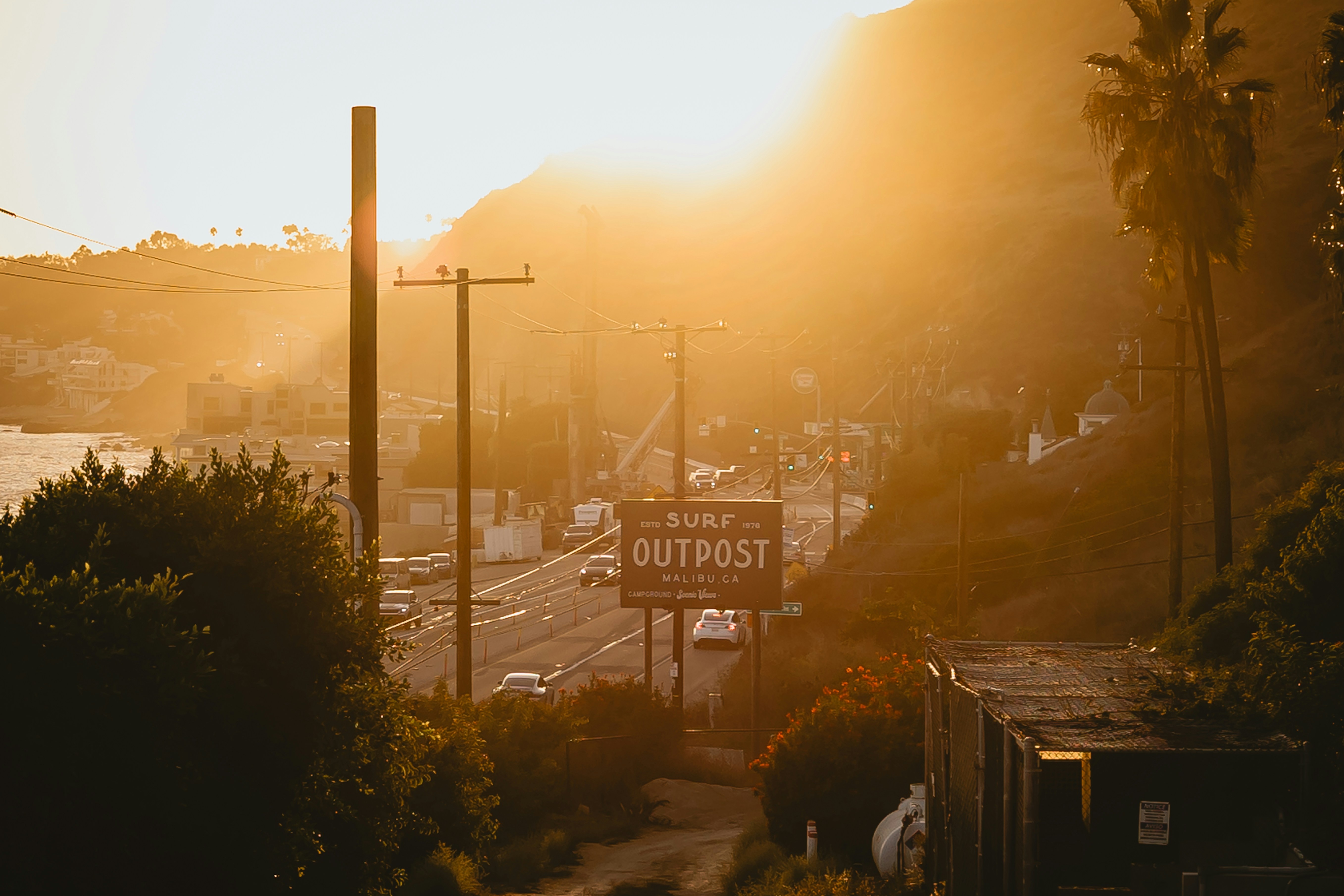 Golden Hour Overlook: A Quiet Road Framed by Silhouettes