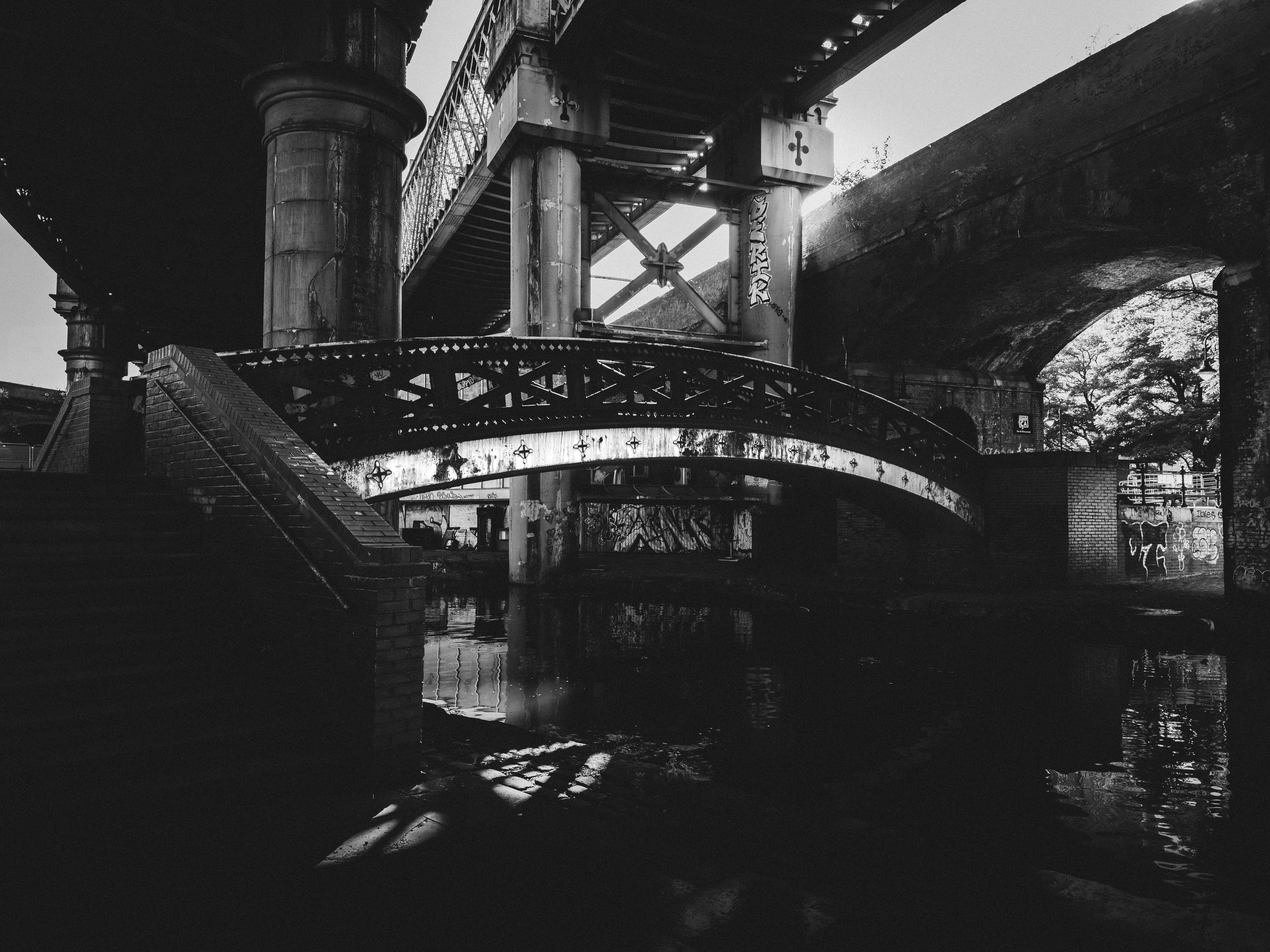 Echoes Under the Iron Span: A Monochrome Canal Crossing