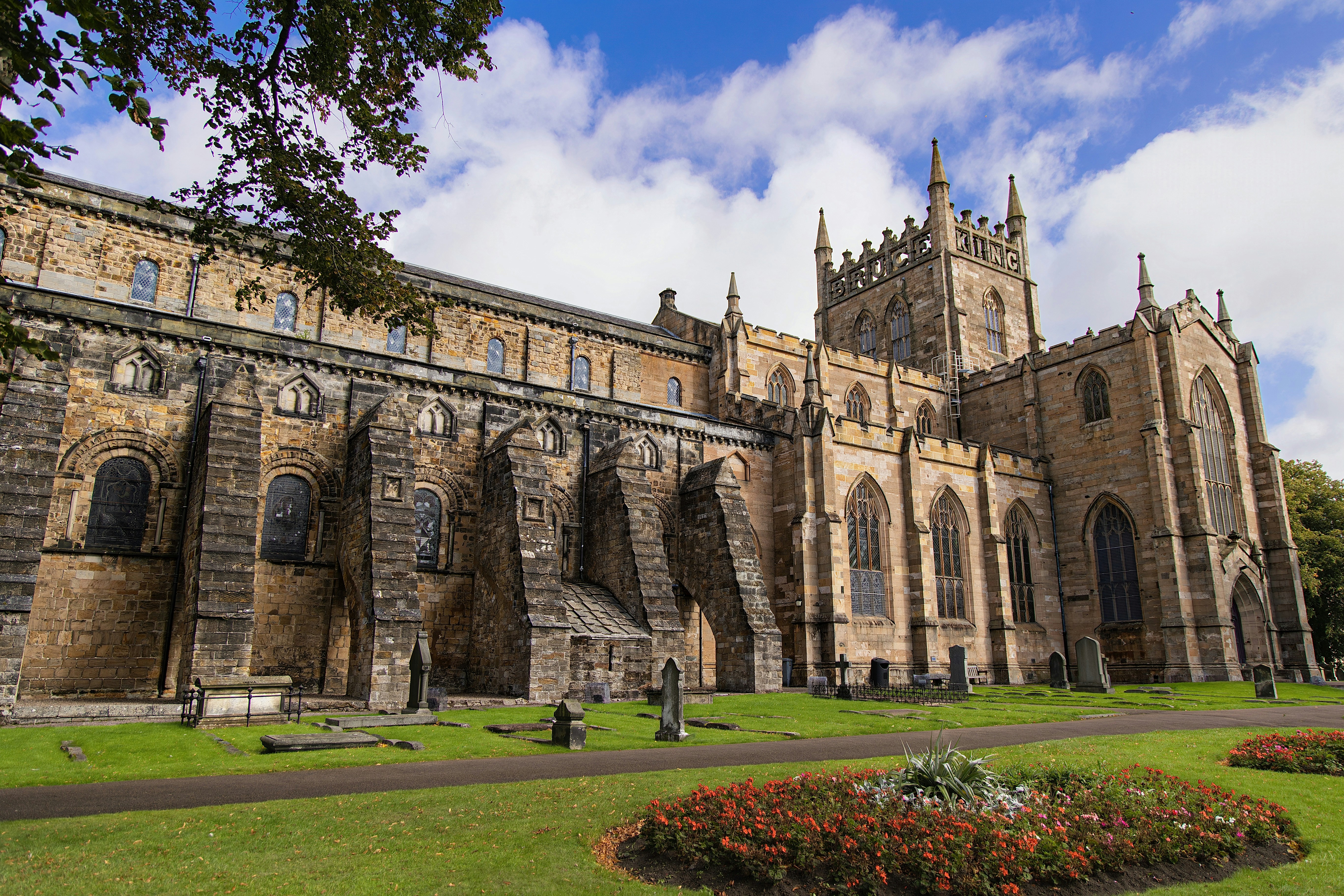 Stone Cathedral Facade under a Cloudy Sky