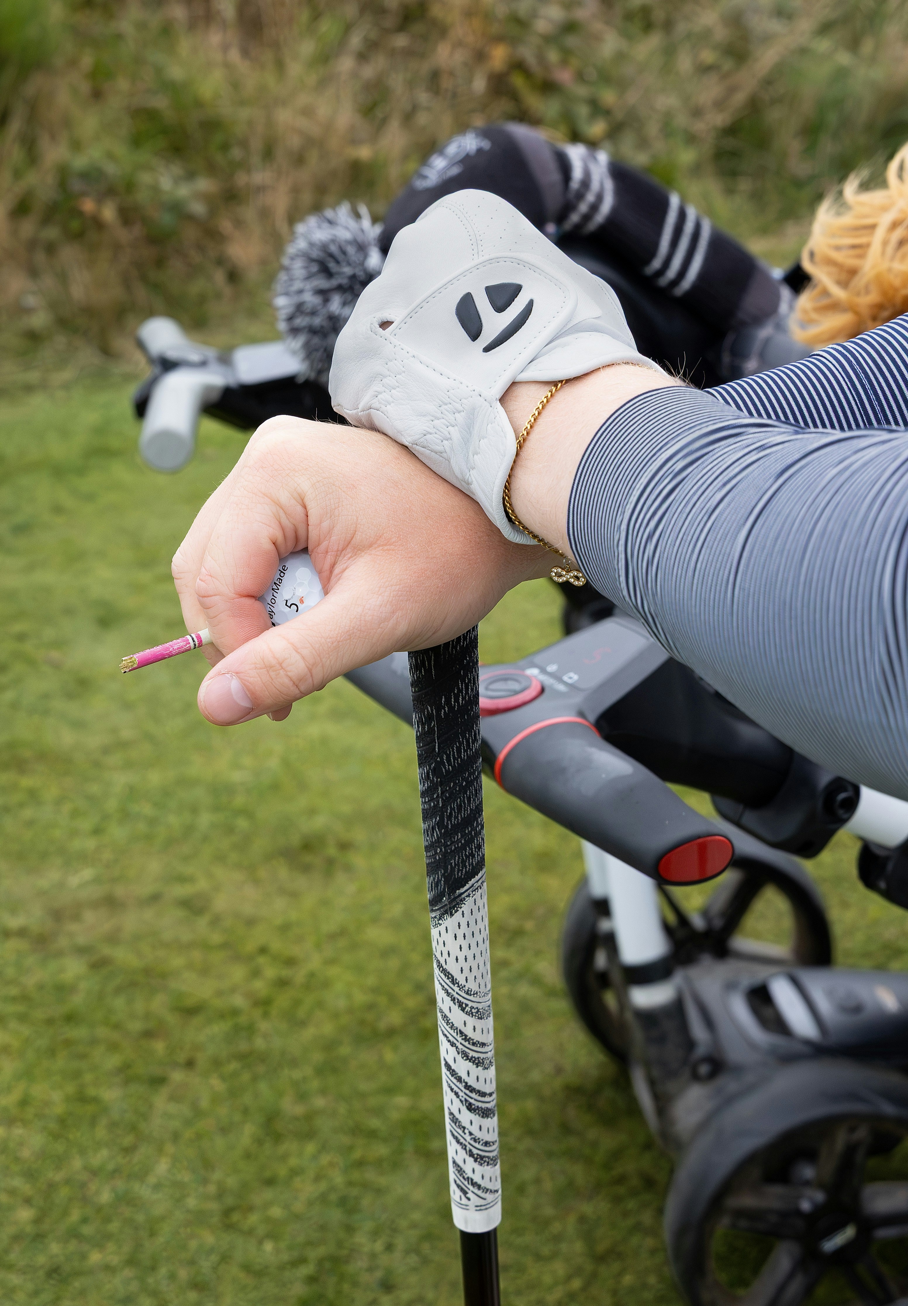 Grip and Glint: A Cyclist's Hand at the Ready