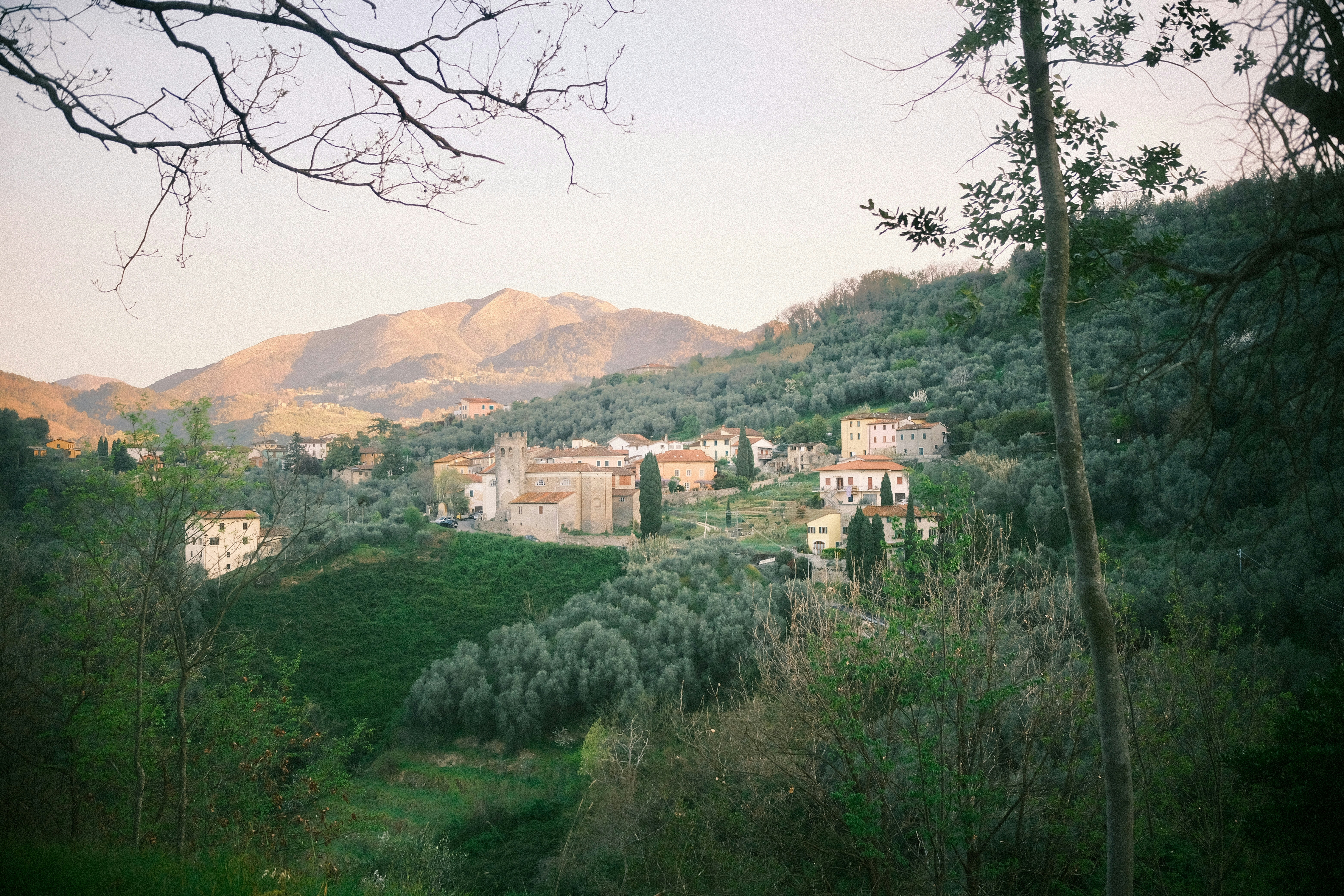 Sun-Kissed hillside village tucked in a green valley
