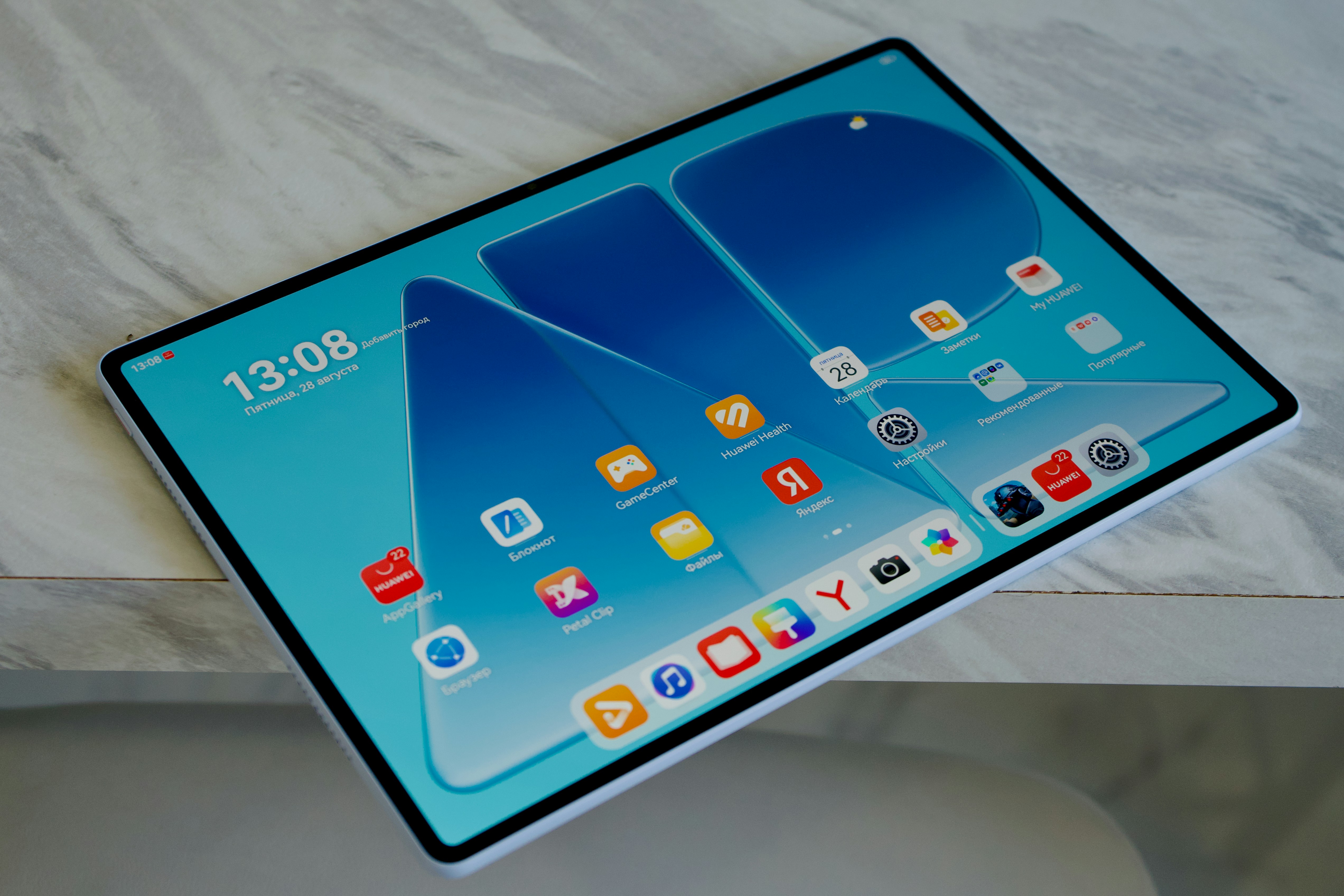 Tilted Tablet Dream: A Modern Slate Gliding Along a Marble Surface