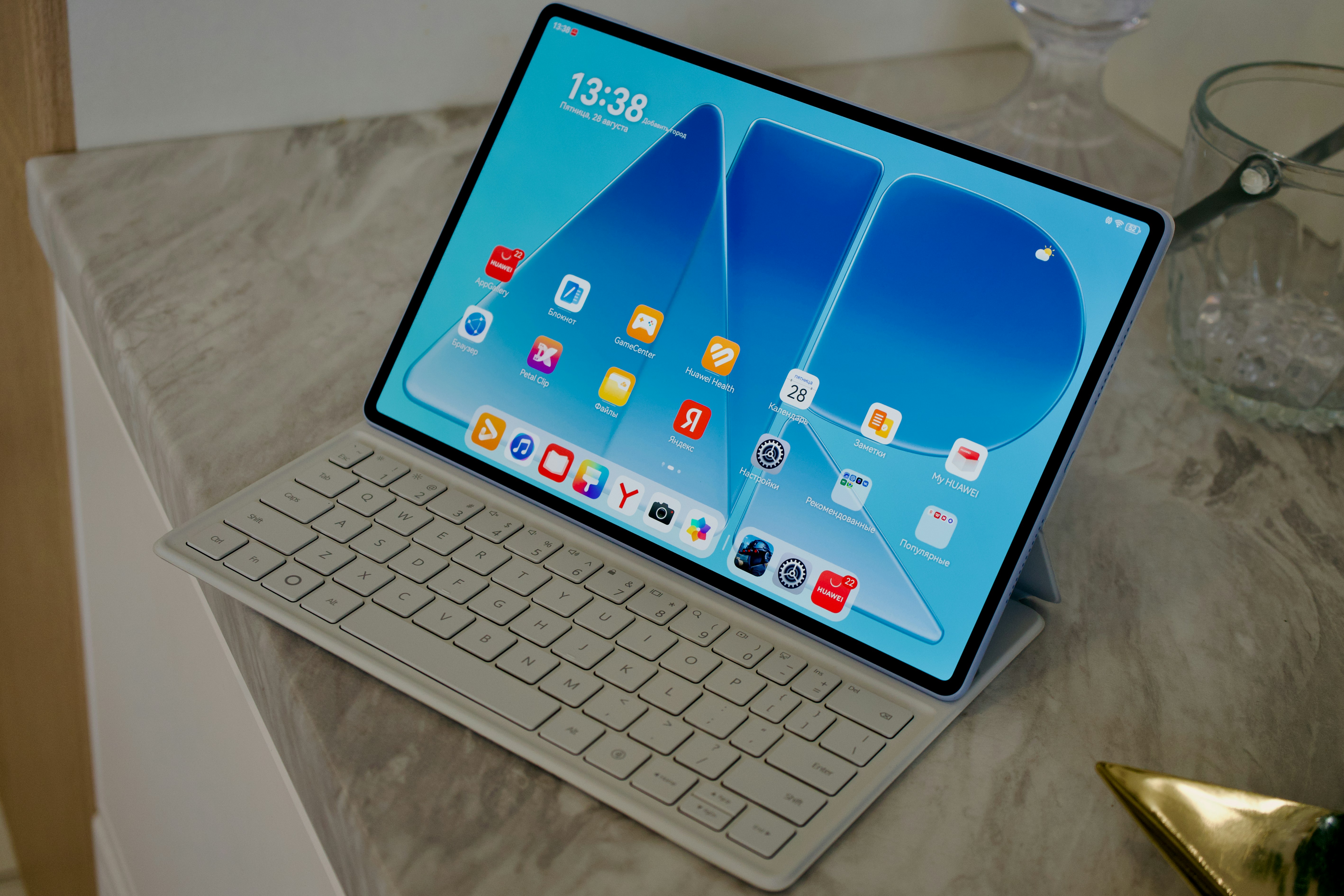 Slate device on a marble desk: a modern tablet with keyboard stand