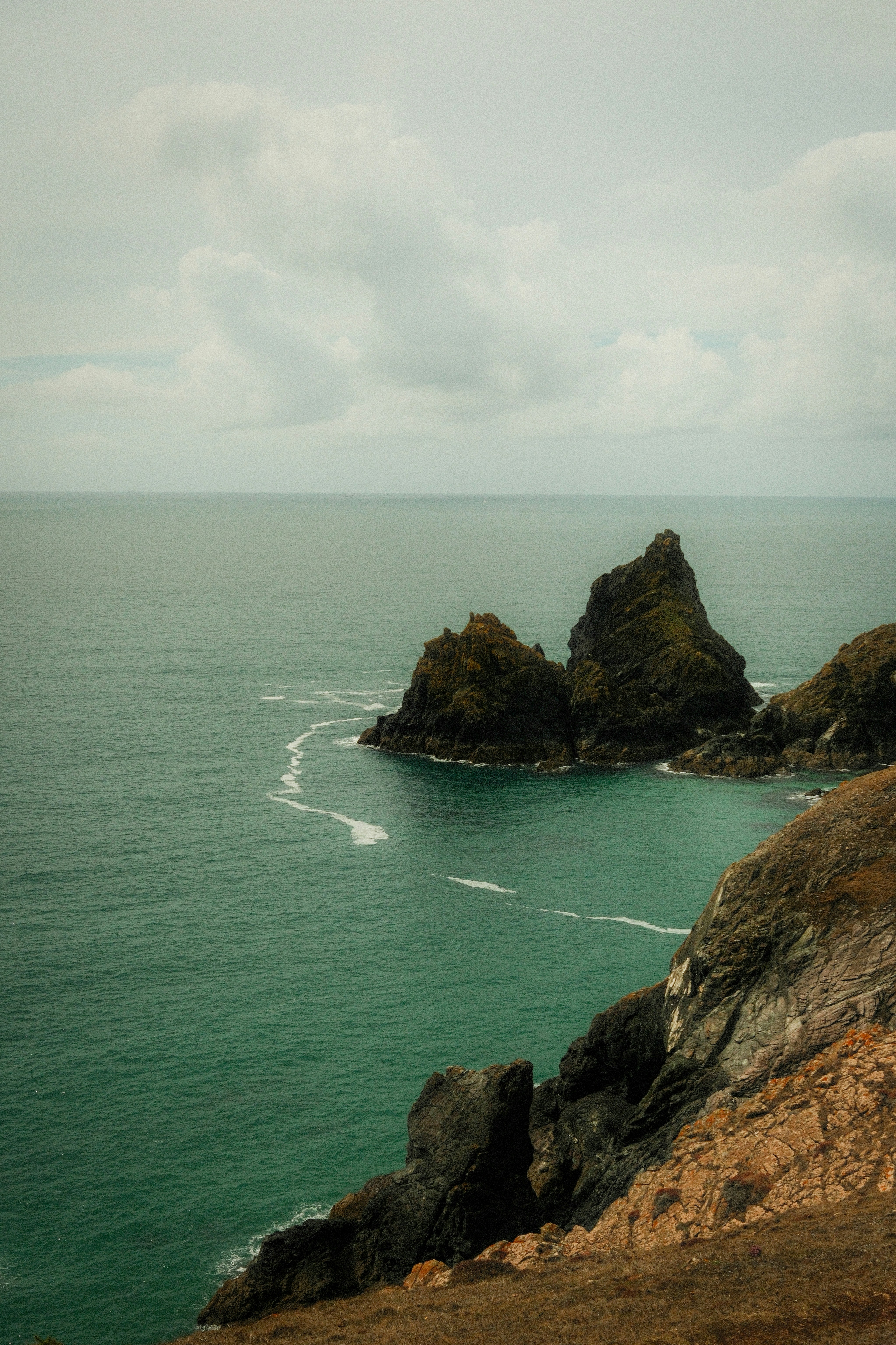 Rugged Promontory Meeting a Quiet Sea