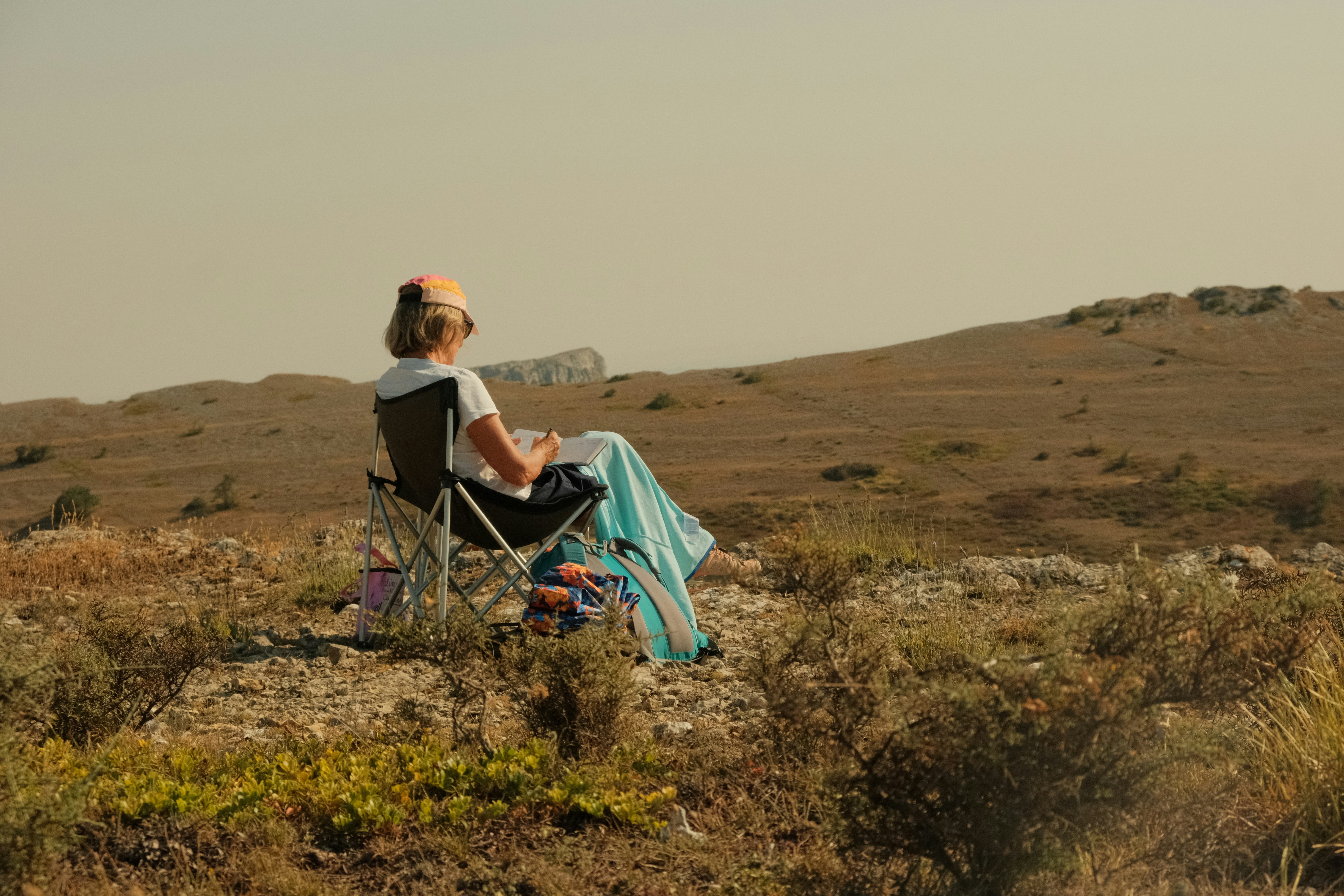 Solitary Reader Beneath an Open Sky