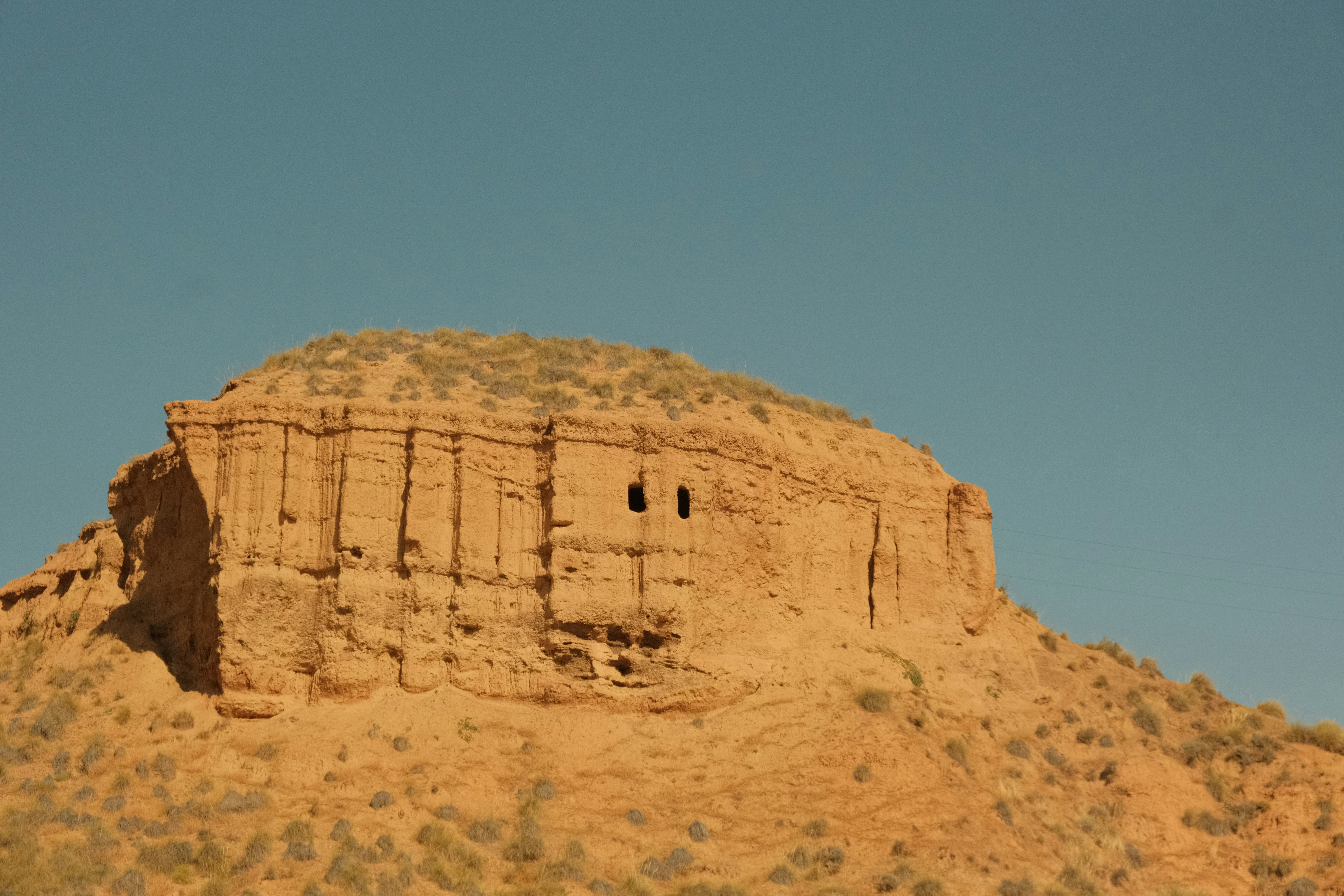 Desert Cliffs: Weathered Fortress on the Hill