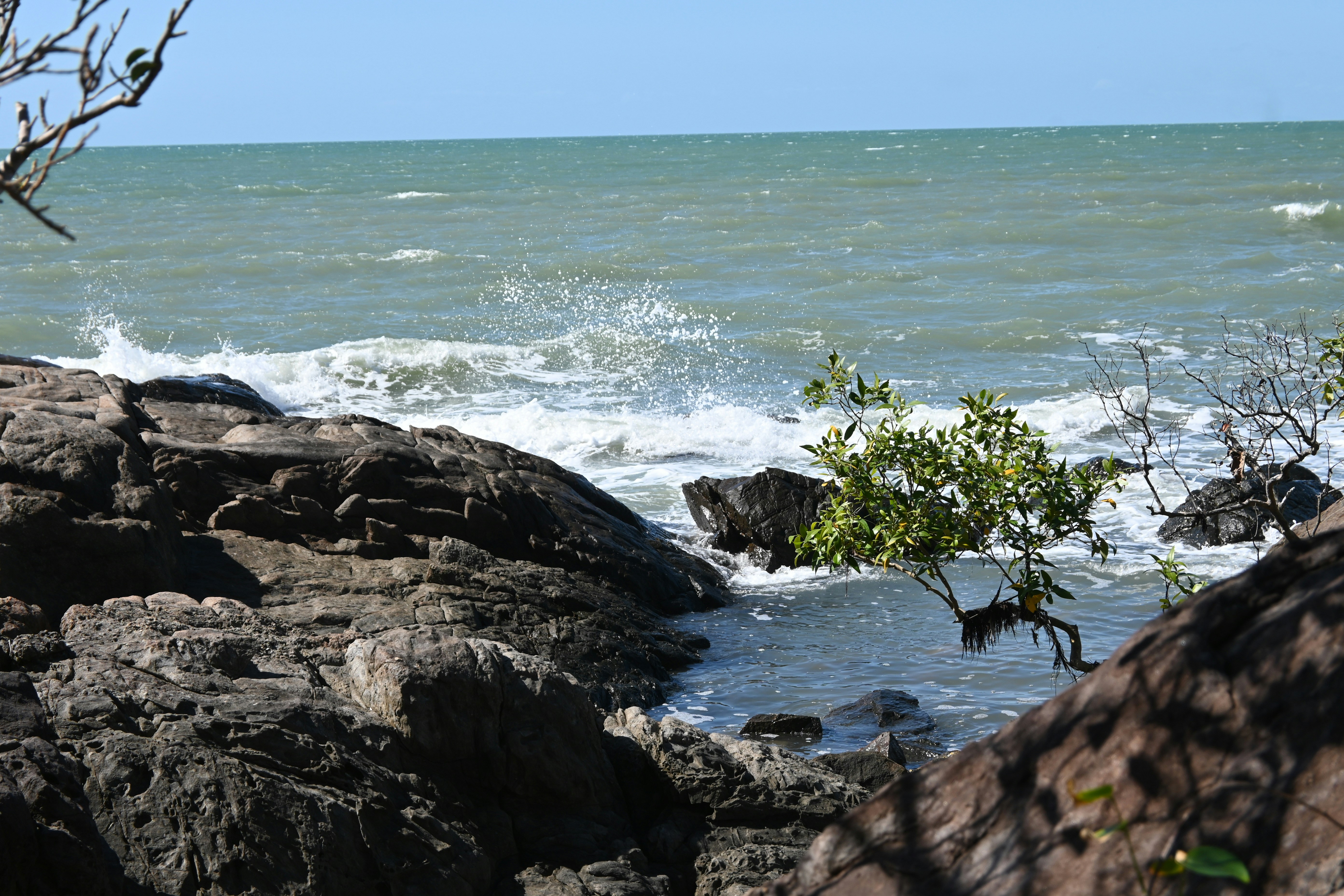 Coastal Rock Crest Rings the Turquoise Sea