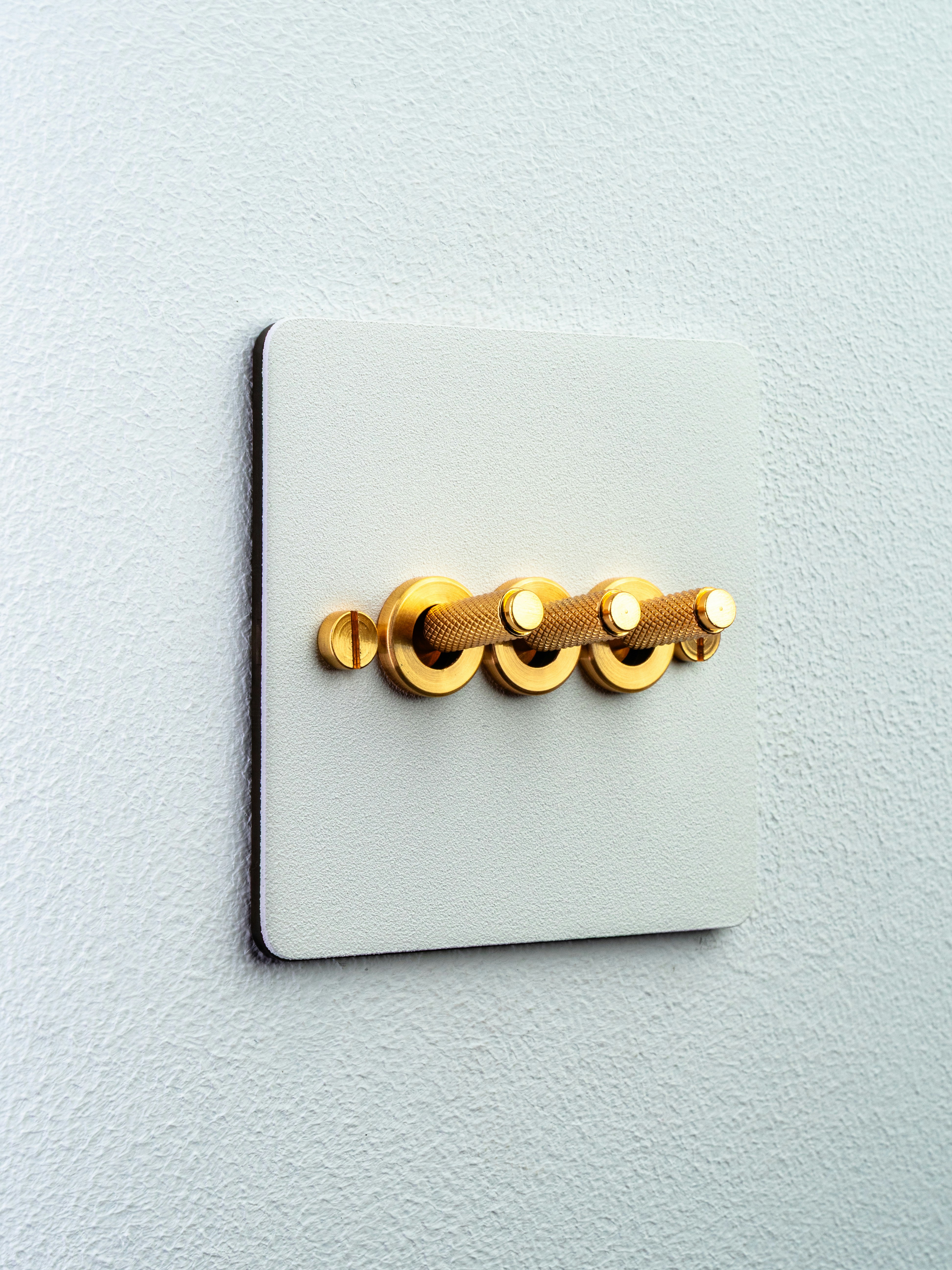Golden Dials on a Smooth Gray Panel