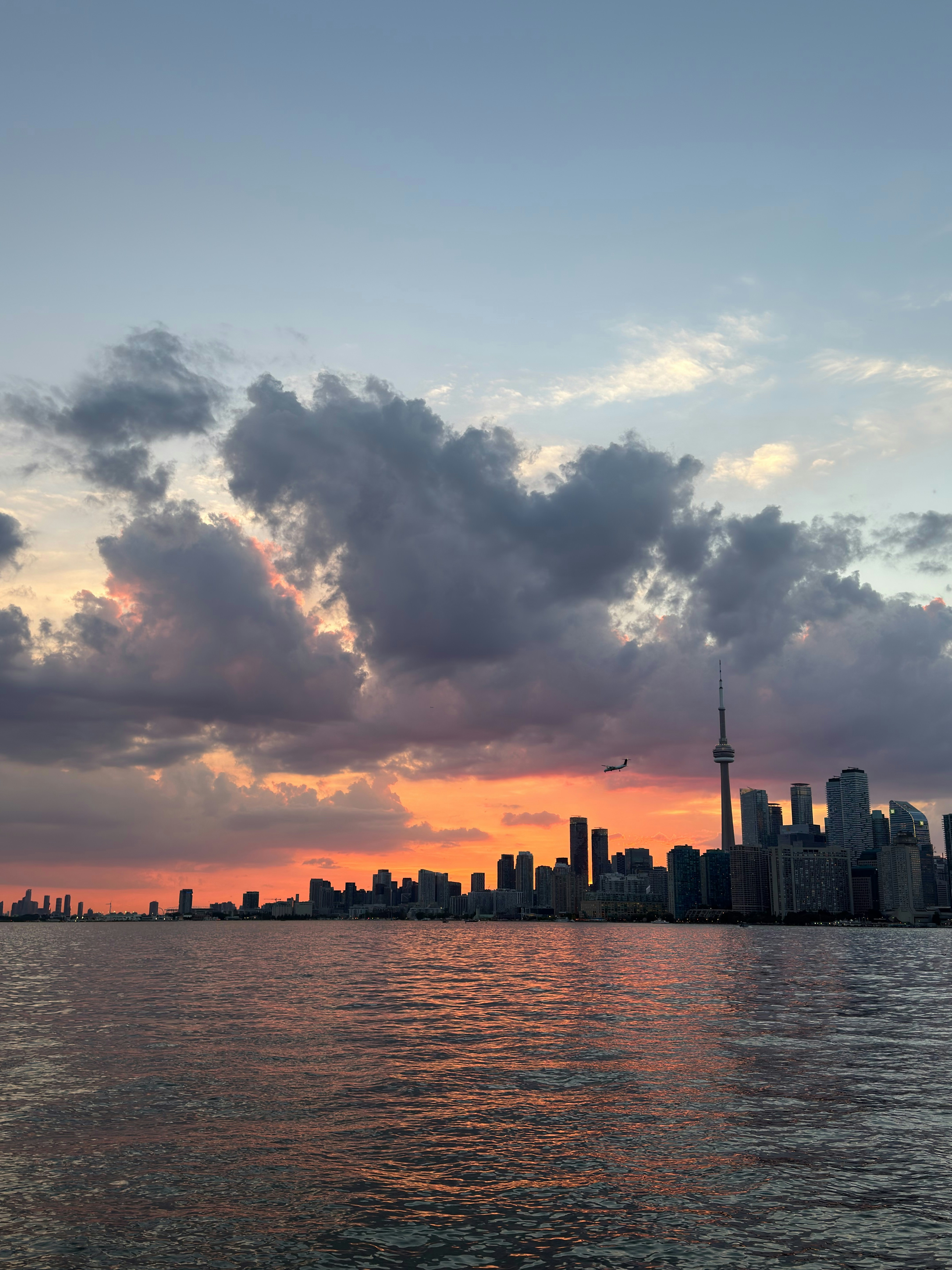 Sunset Silhouette over a City Wake