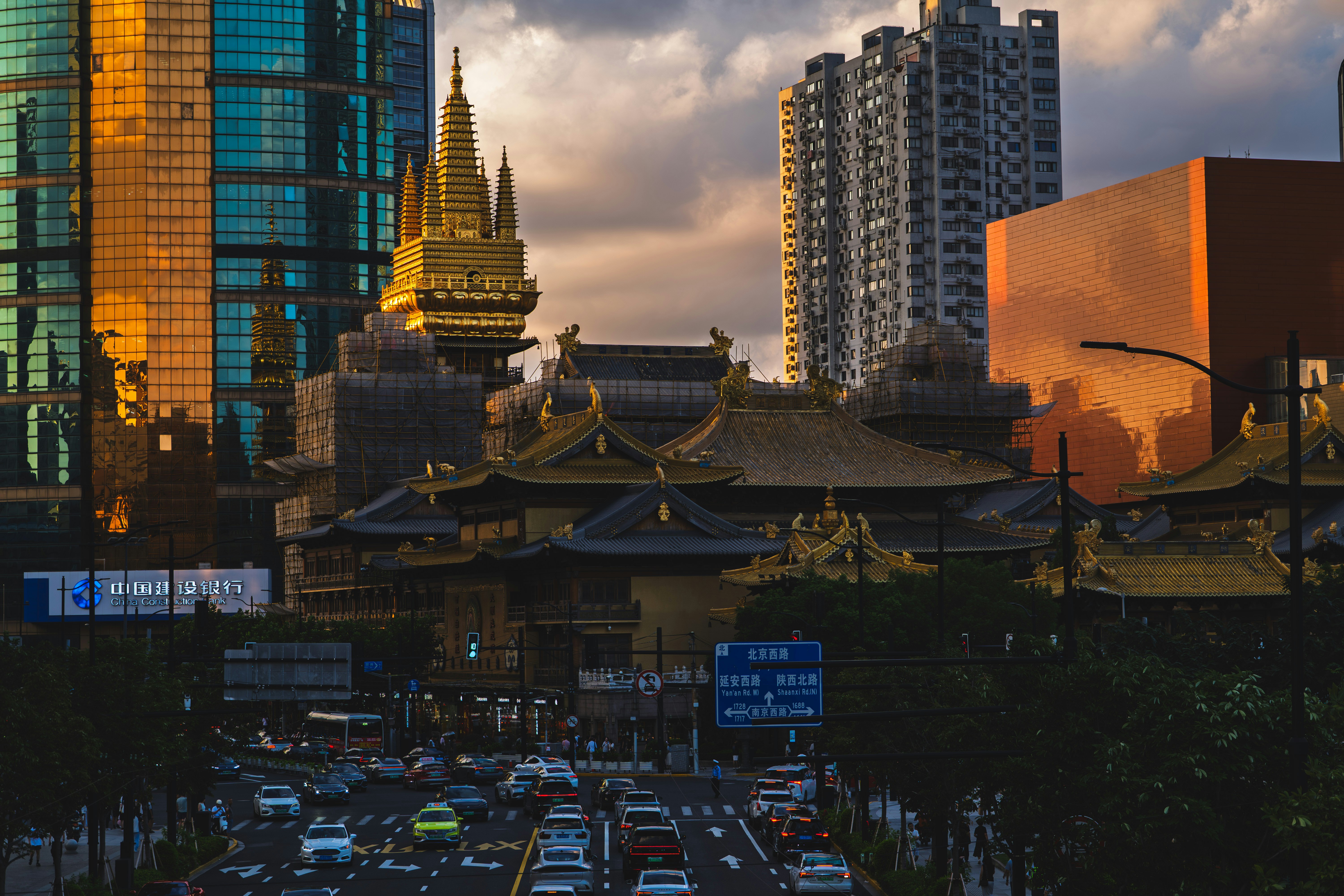 City Gate Echoes: Modern Towers Framing a Historic Rooftop
