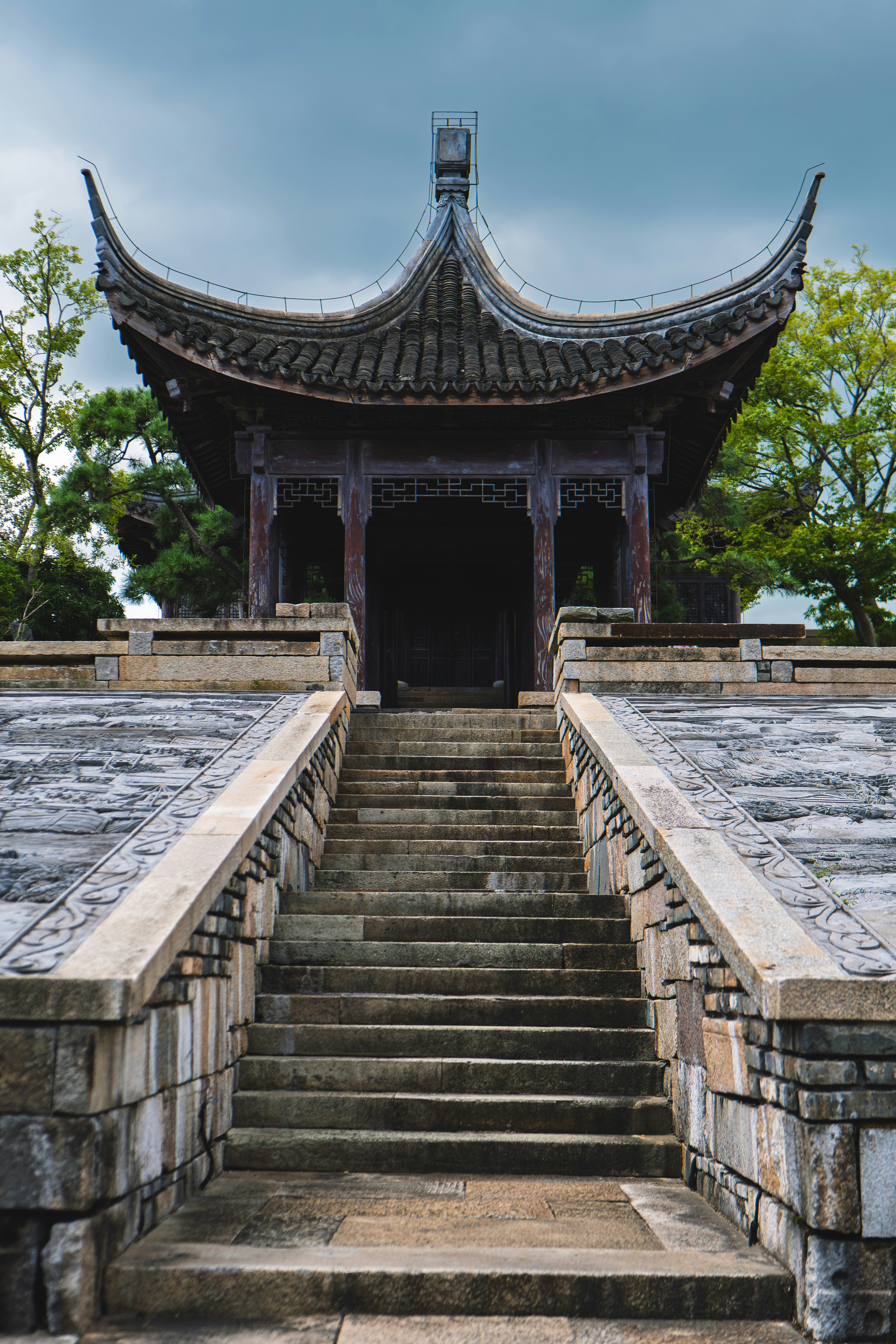 Gateway to Harmony: Steps Toward the Curved Roof Temple