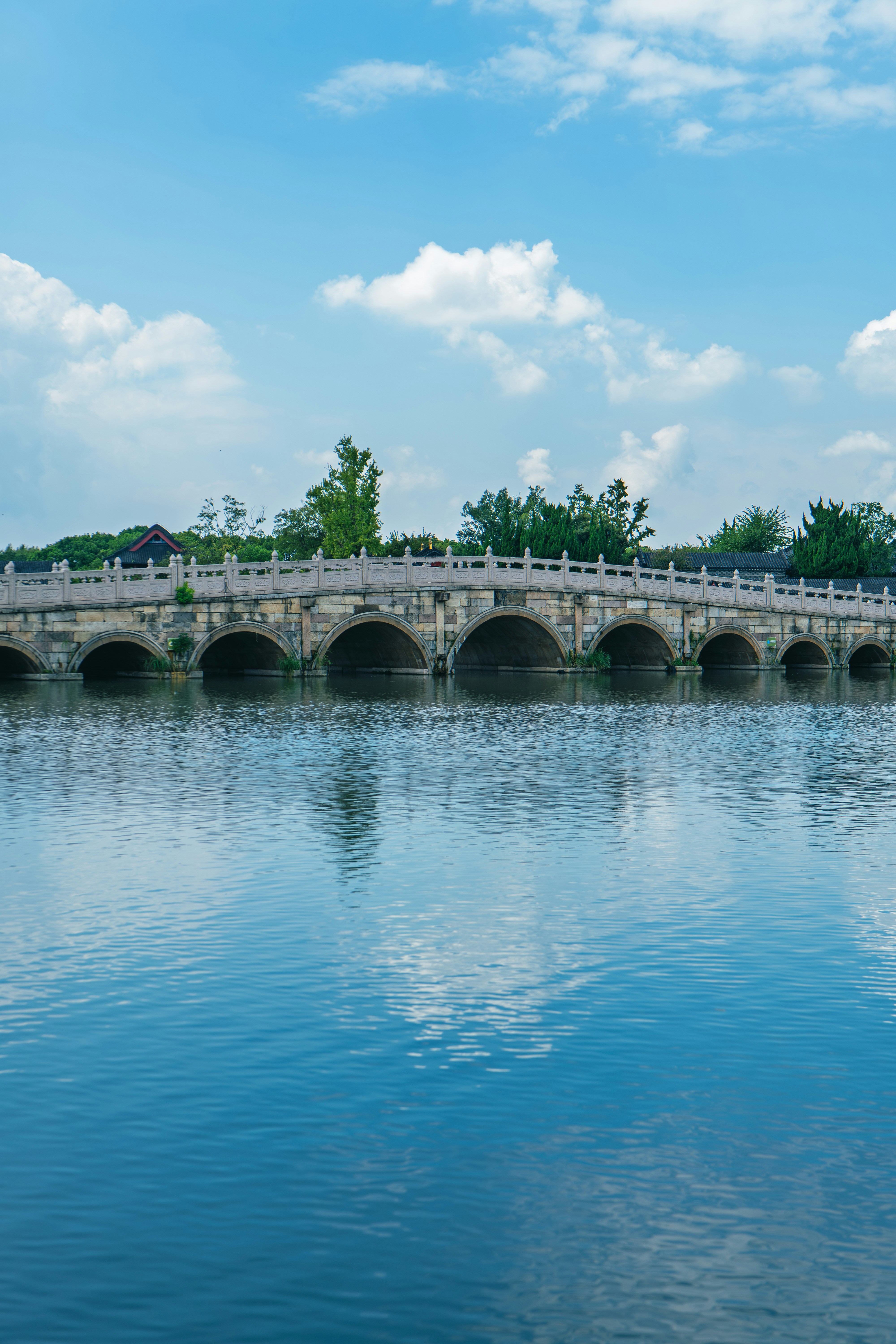 Stone Bridge over Calm Waters at Noon