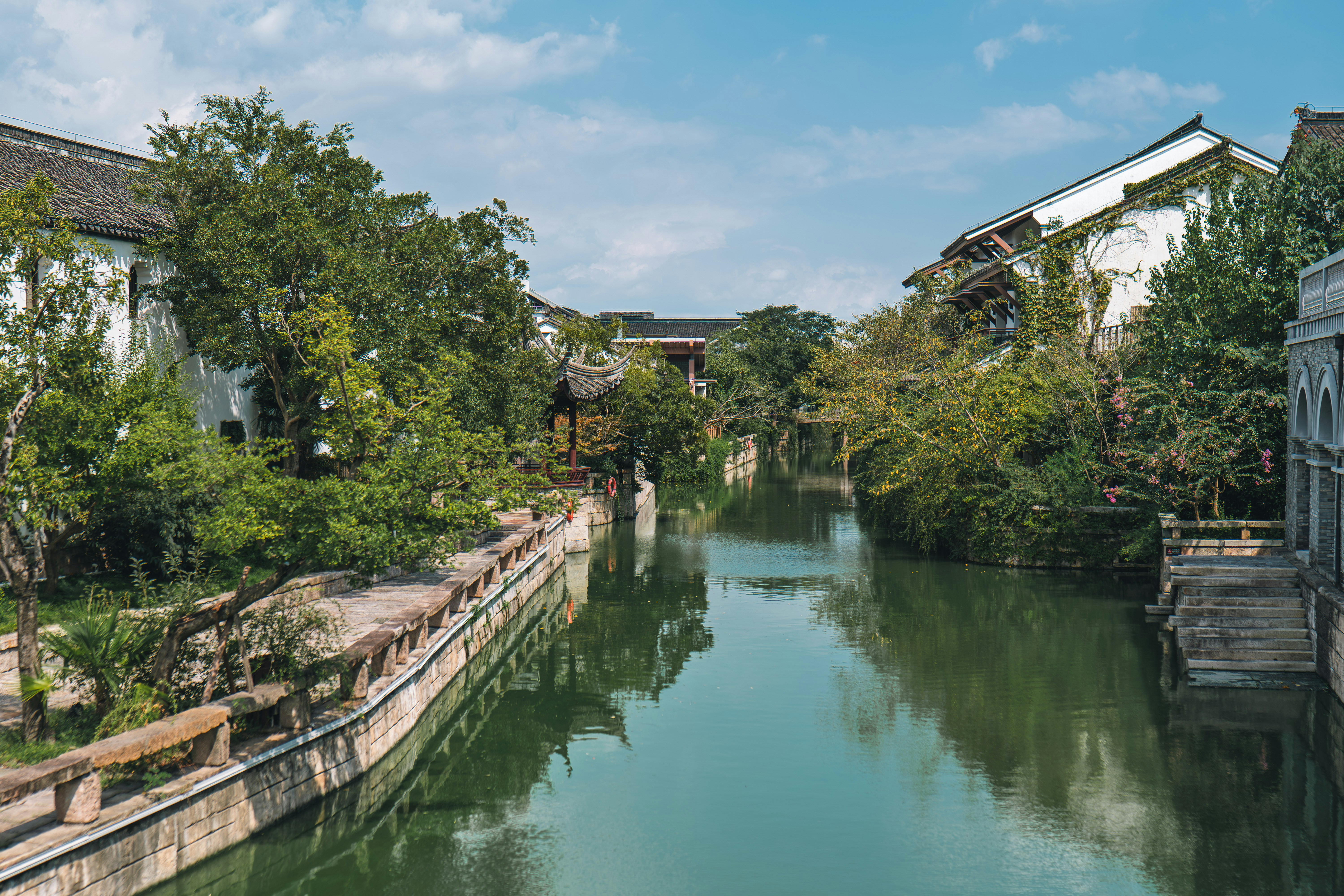 Quiet canal in a traditional water town under a blue sky