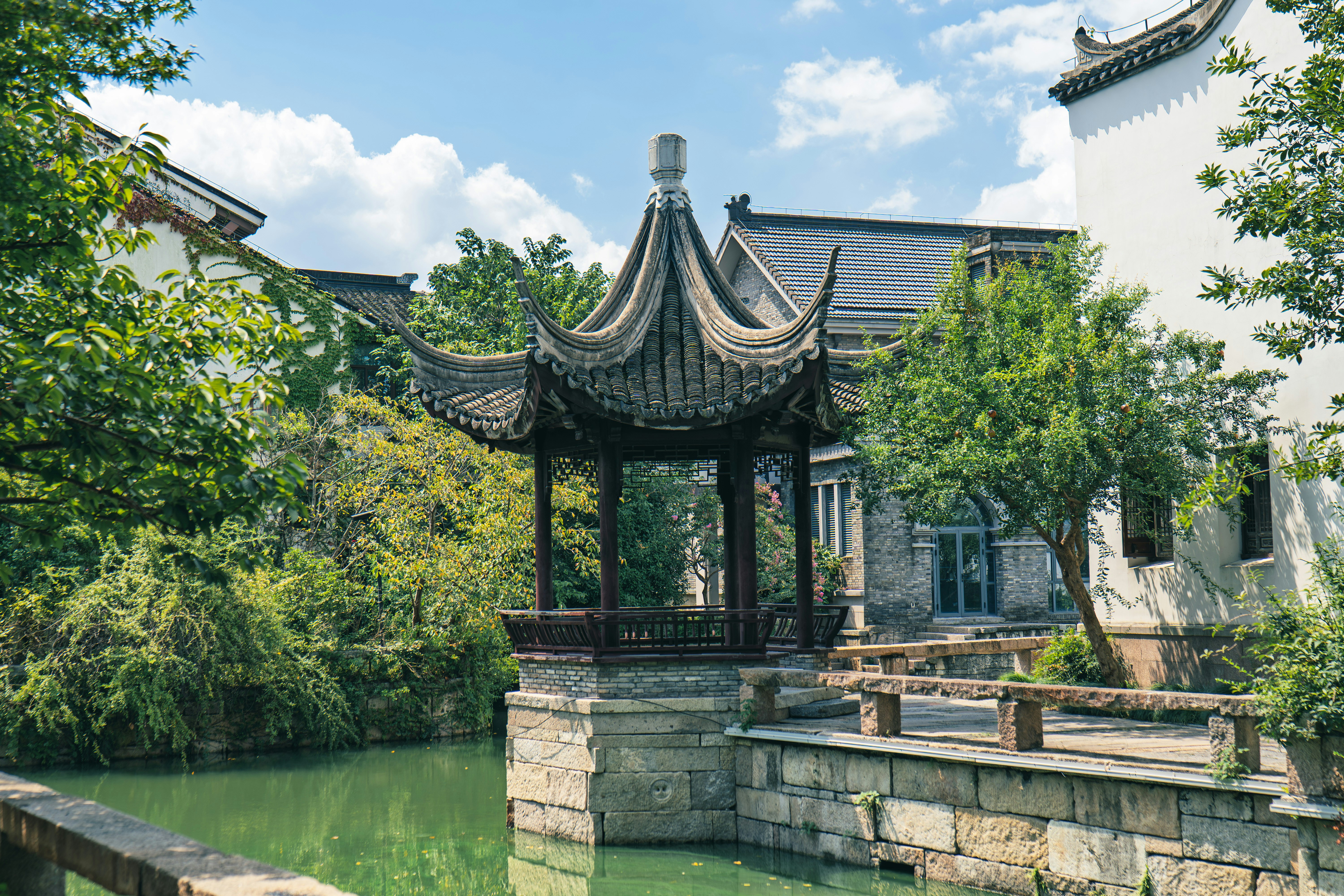 Serene Chinese Pavilion Over a Pond Amid Historic Walls