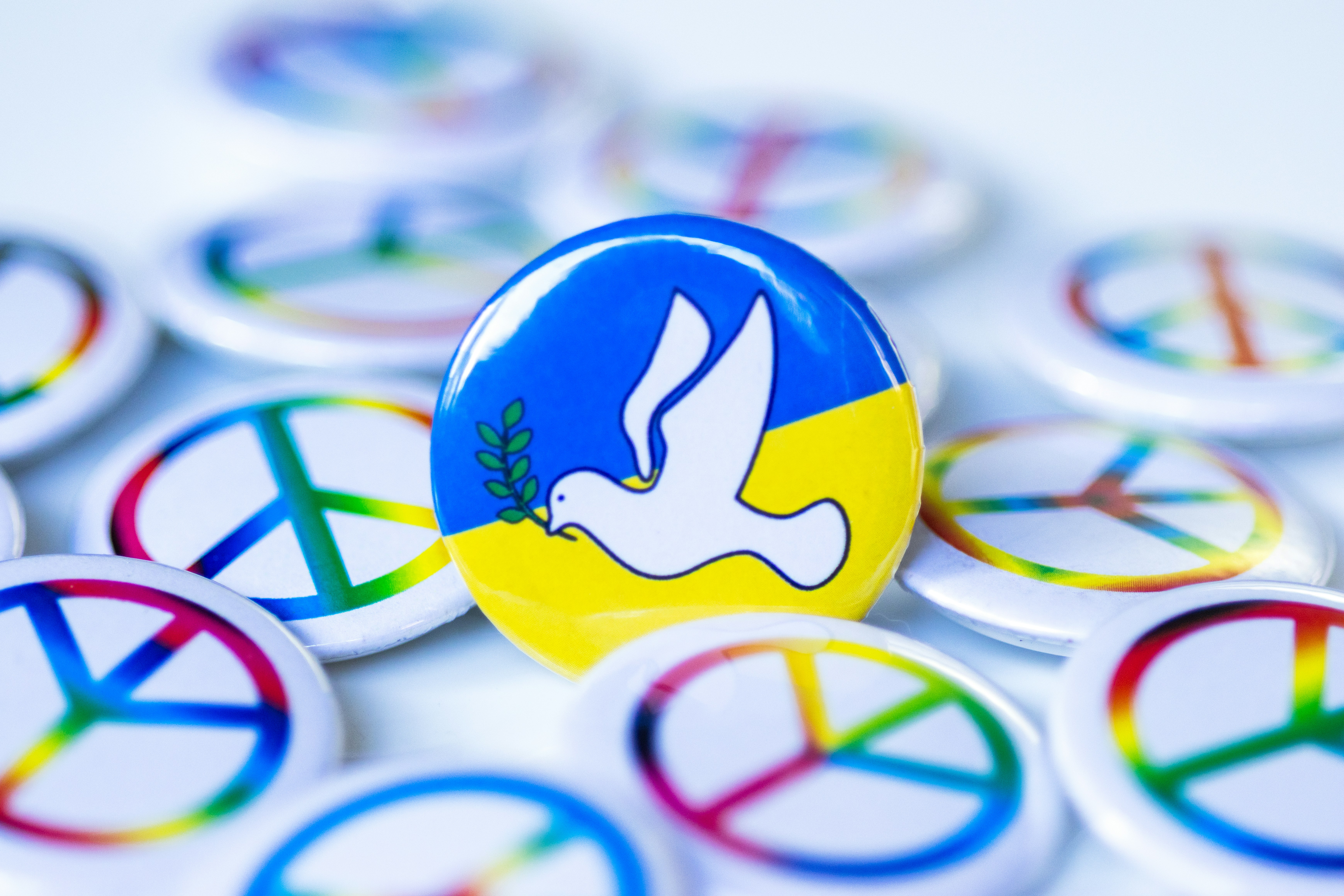 Centerpiece of Peace: A Dove Emblem Amid Colorful Peace Tokens