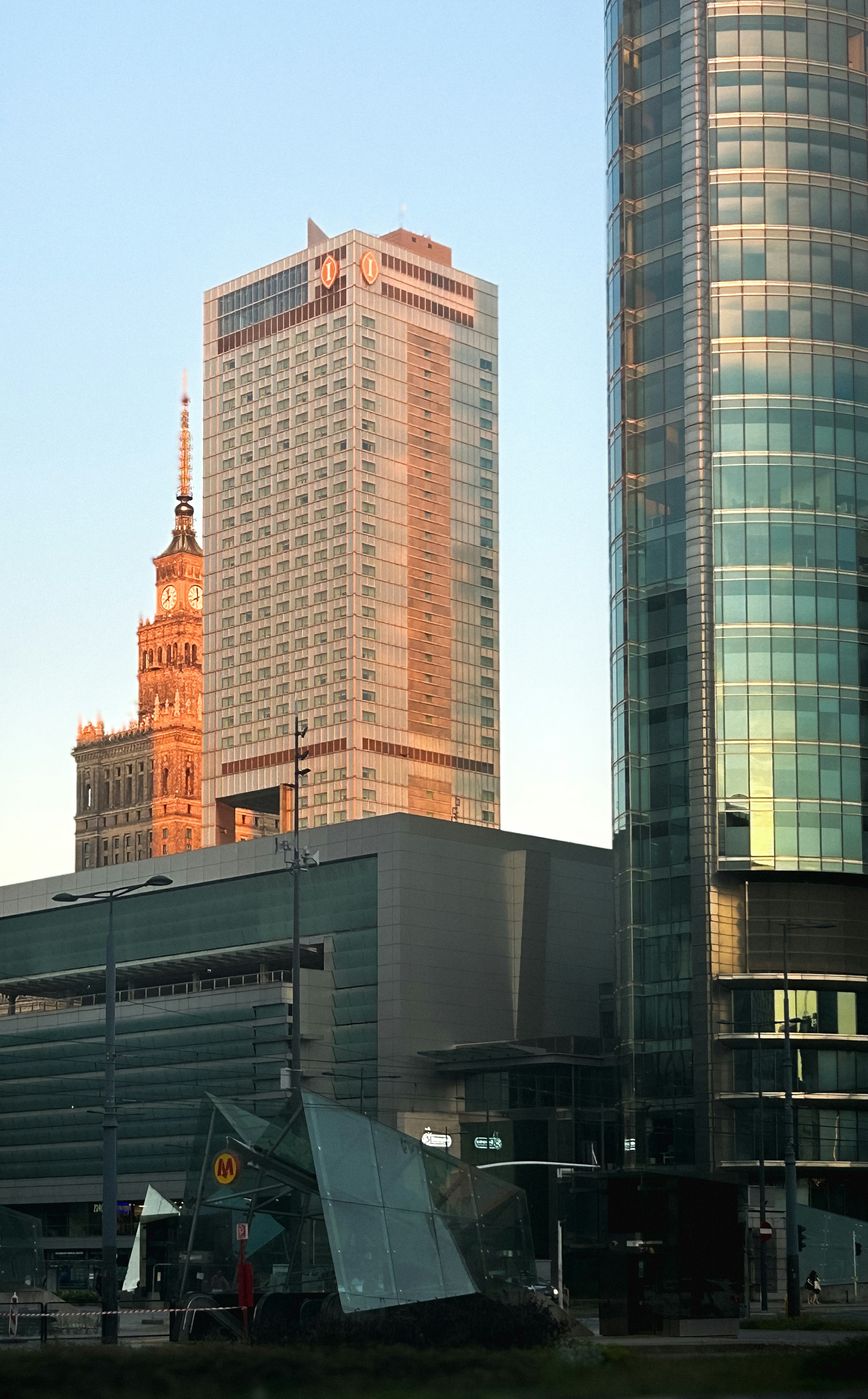 Glass Towers and a Clock Tower: Cityscape in Warm Evening Light