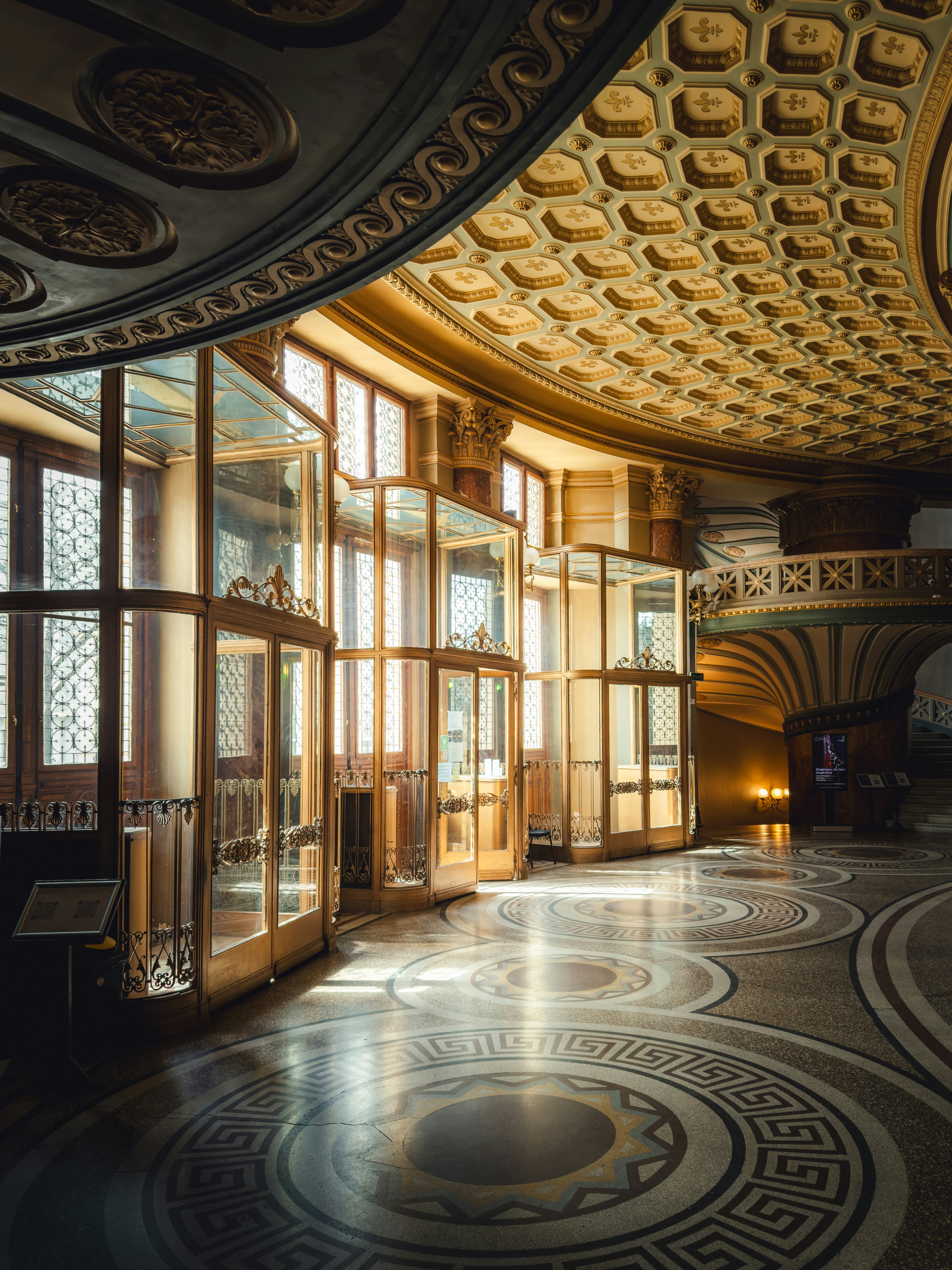 Glass Displayed Echoes: A Sunlit Atrium of Circular Patterns