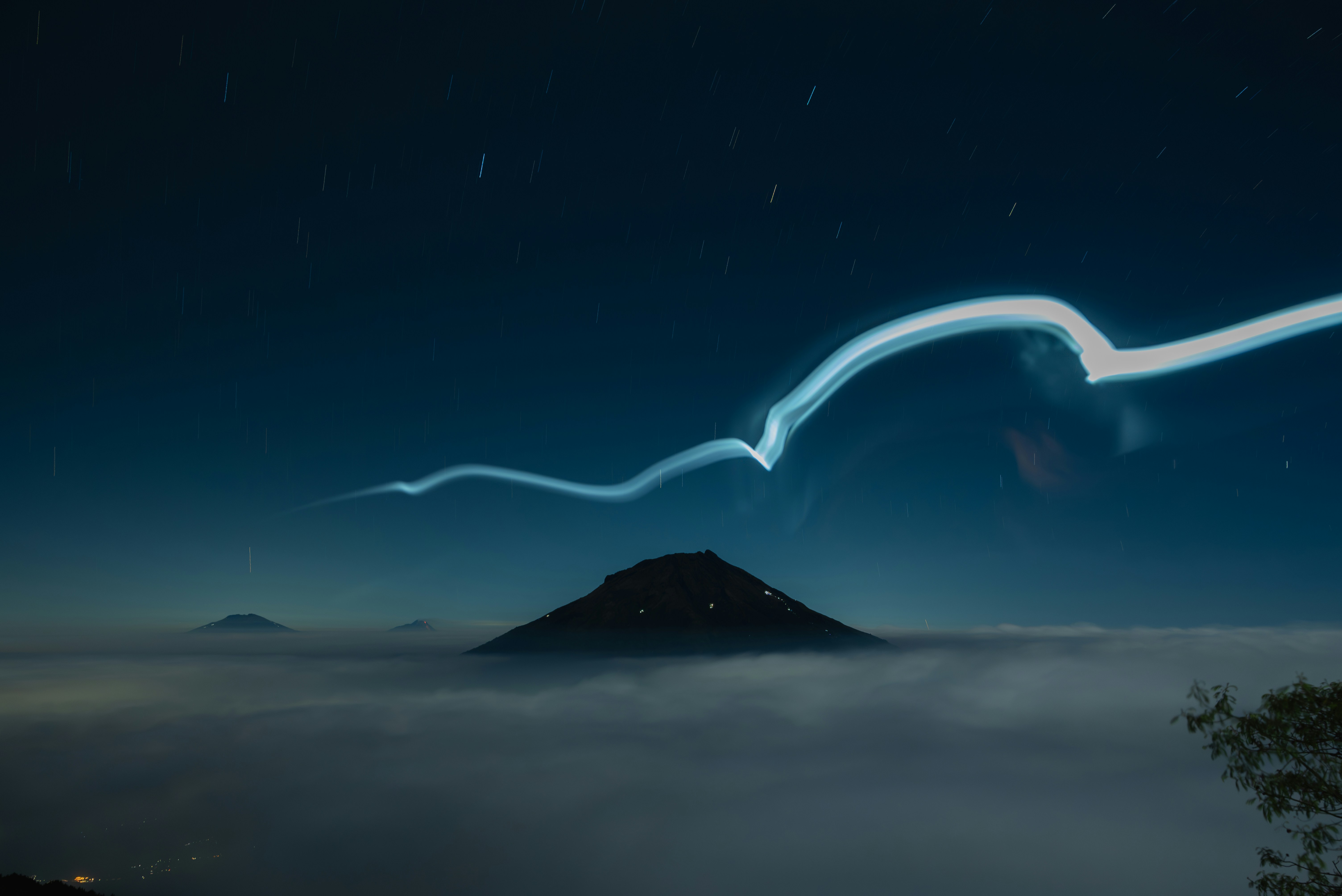 Luminous Arc Over a Valley of Clouds