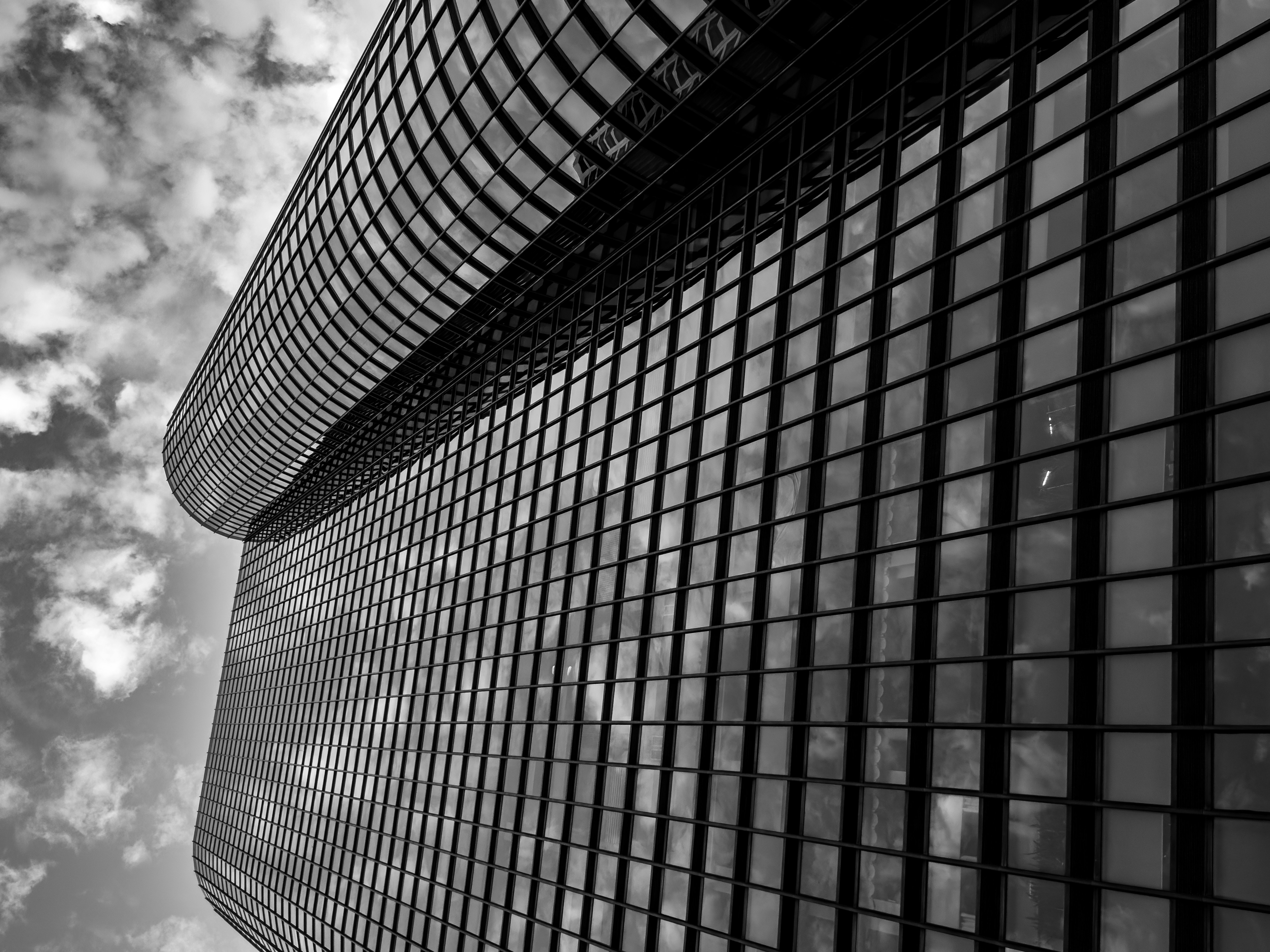Curved Glass Facade: A Geometric Cityscape Rising