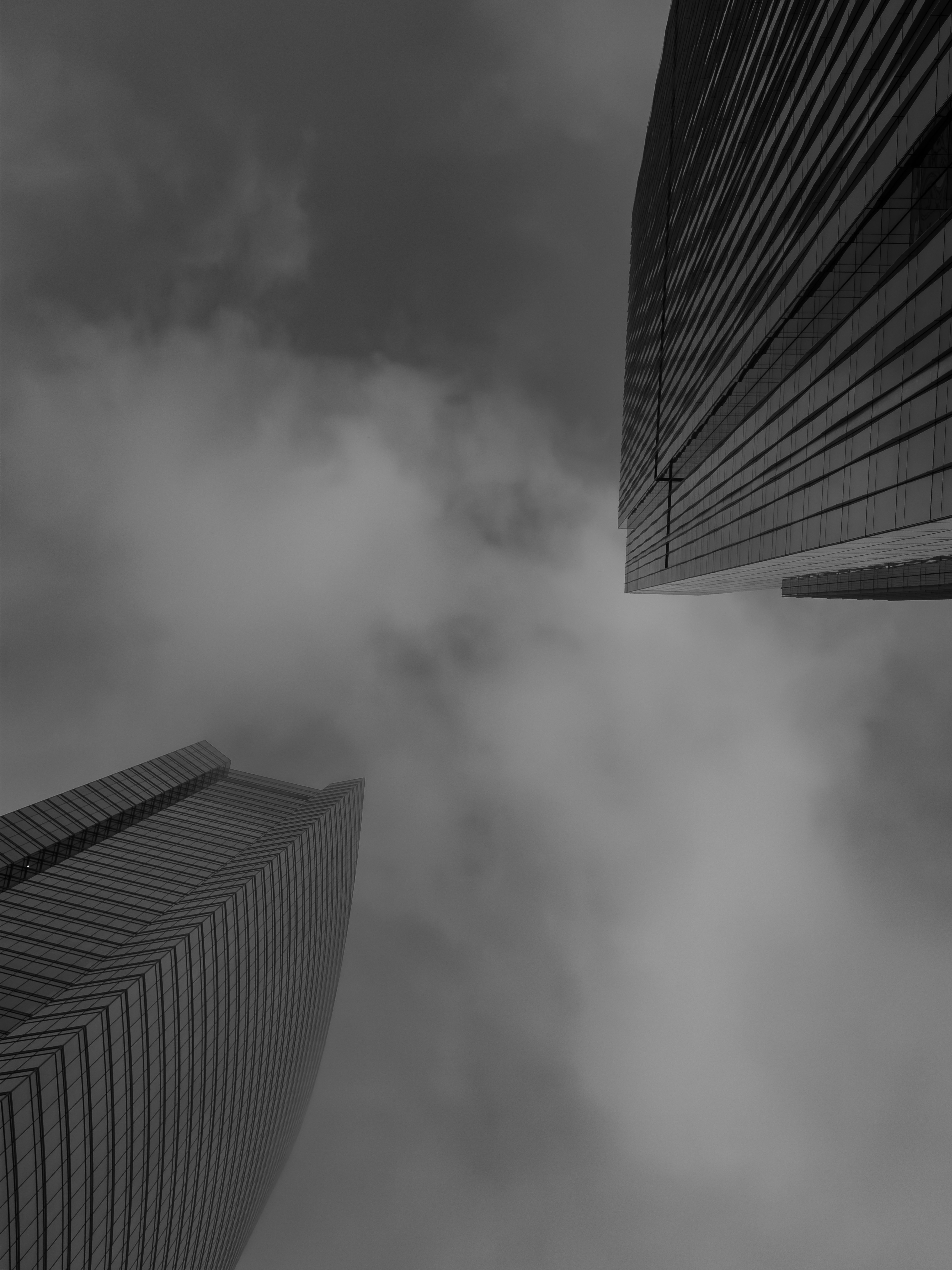 Upward Gaze: Two Skyscrapers Converge Toward a Distant Sky