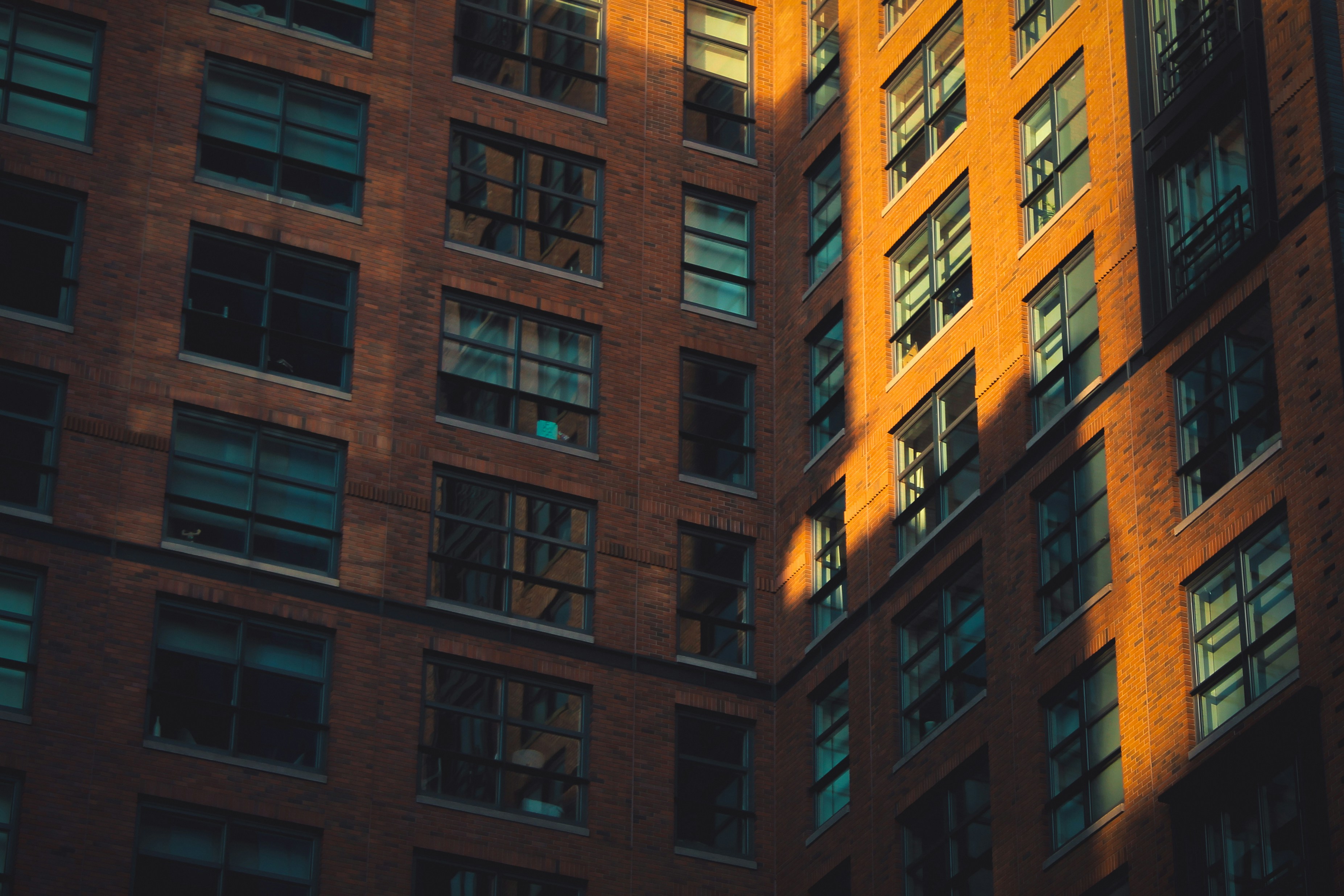 Golden Angle of Brick: Sunlit Facades in a Quiet Courtyard