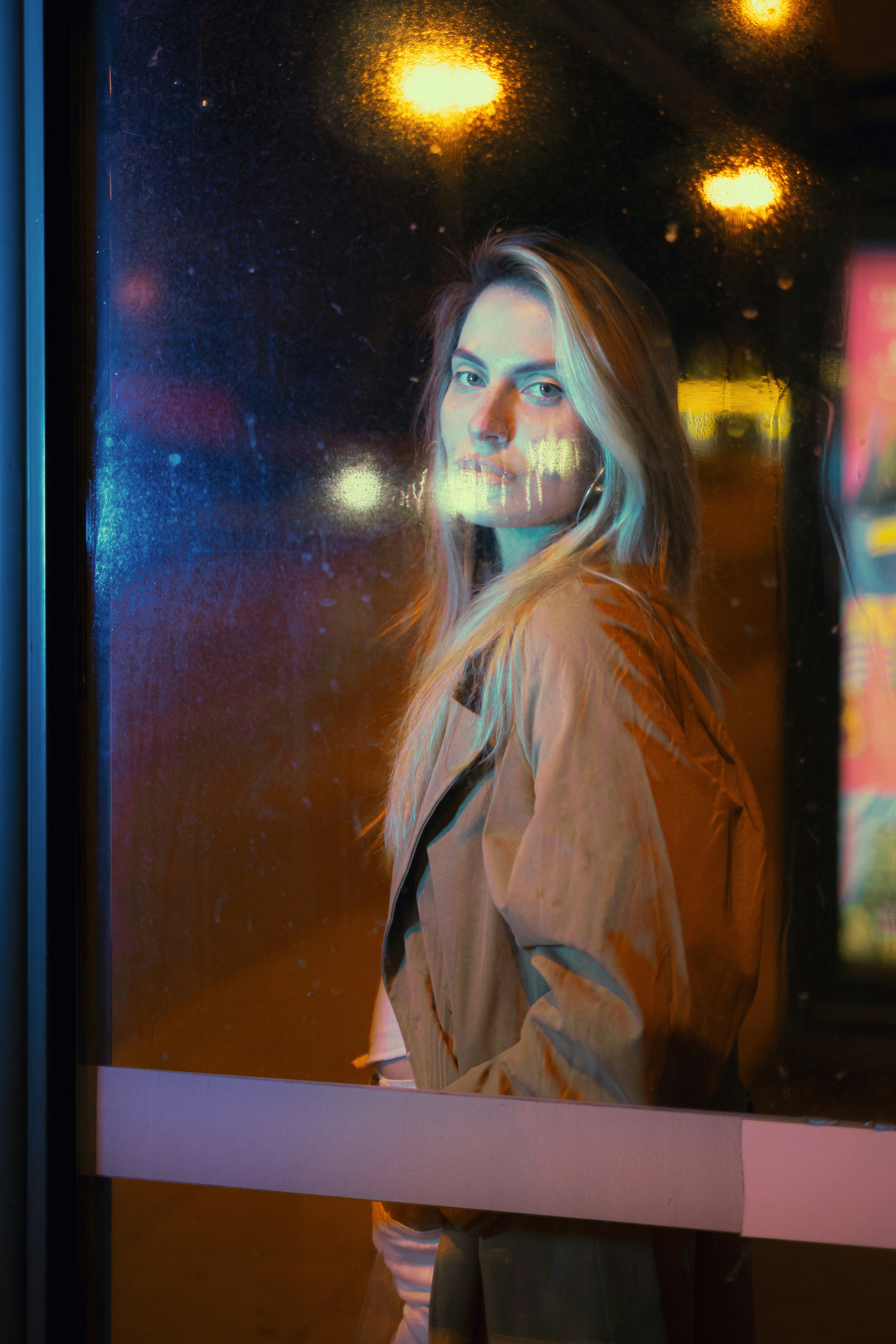 Neon Glow on the Bus Stop Portrait