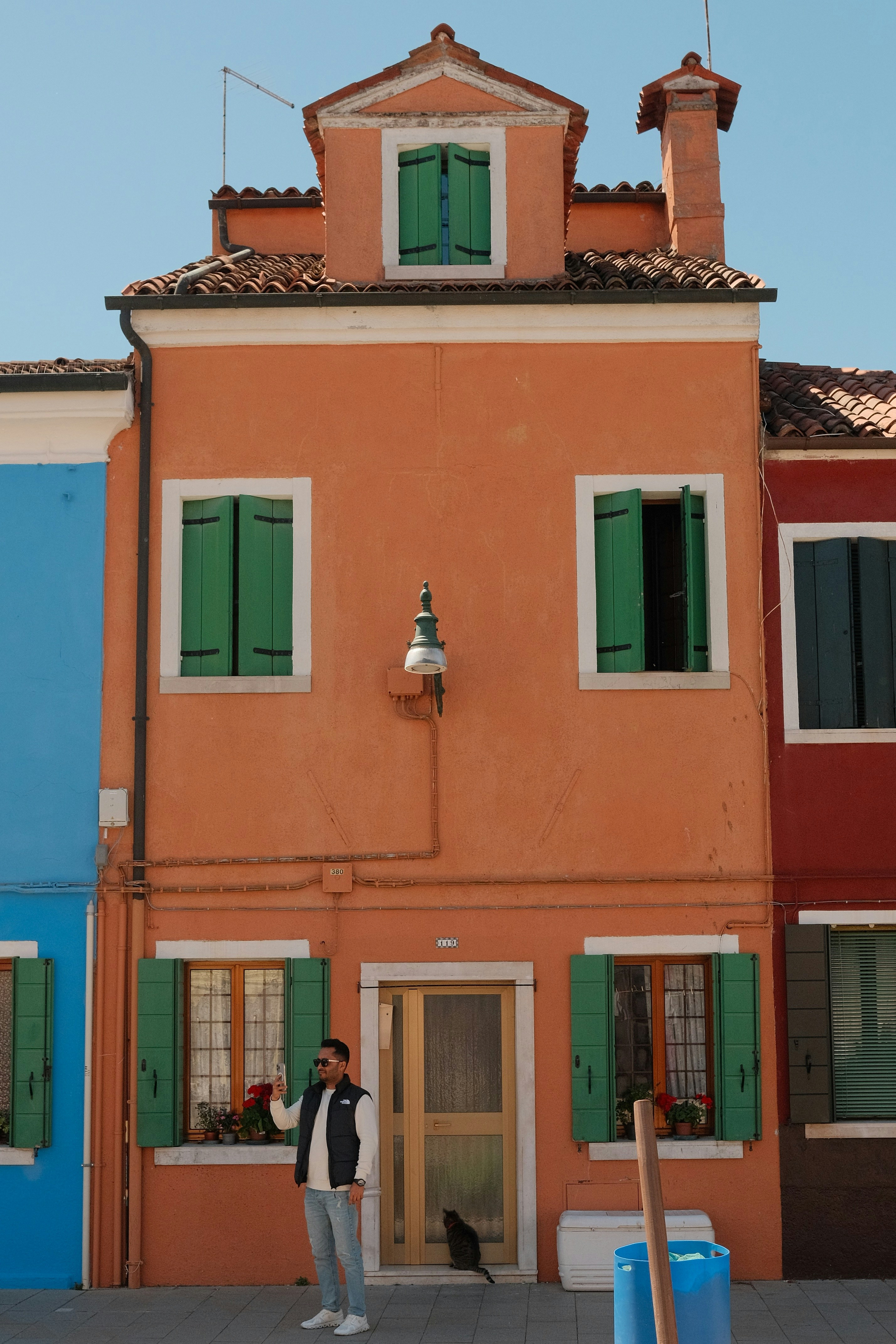 Sunny Facade Parade: Colorful Townhouse with Figural Wardrobe