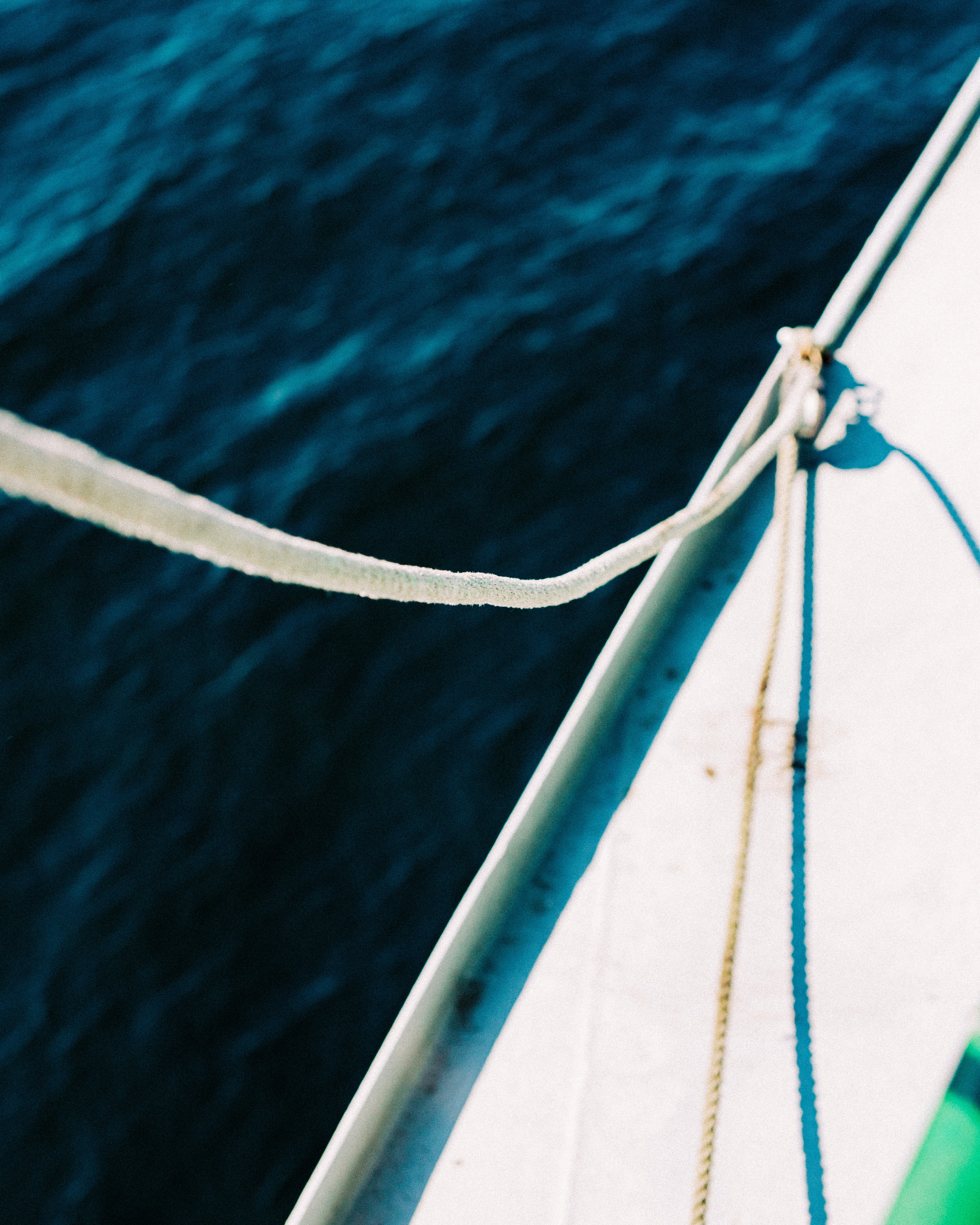 Ropes and Horizon: A Sailboat Edge in Quiet Blue