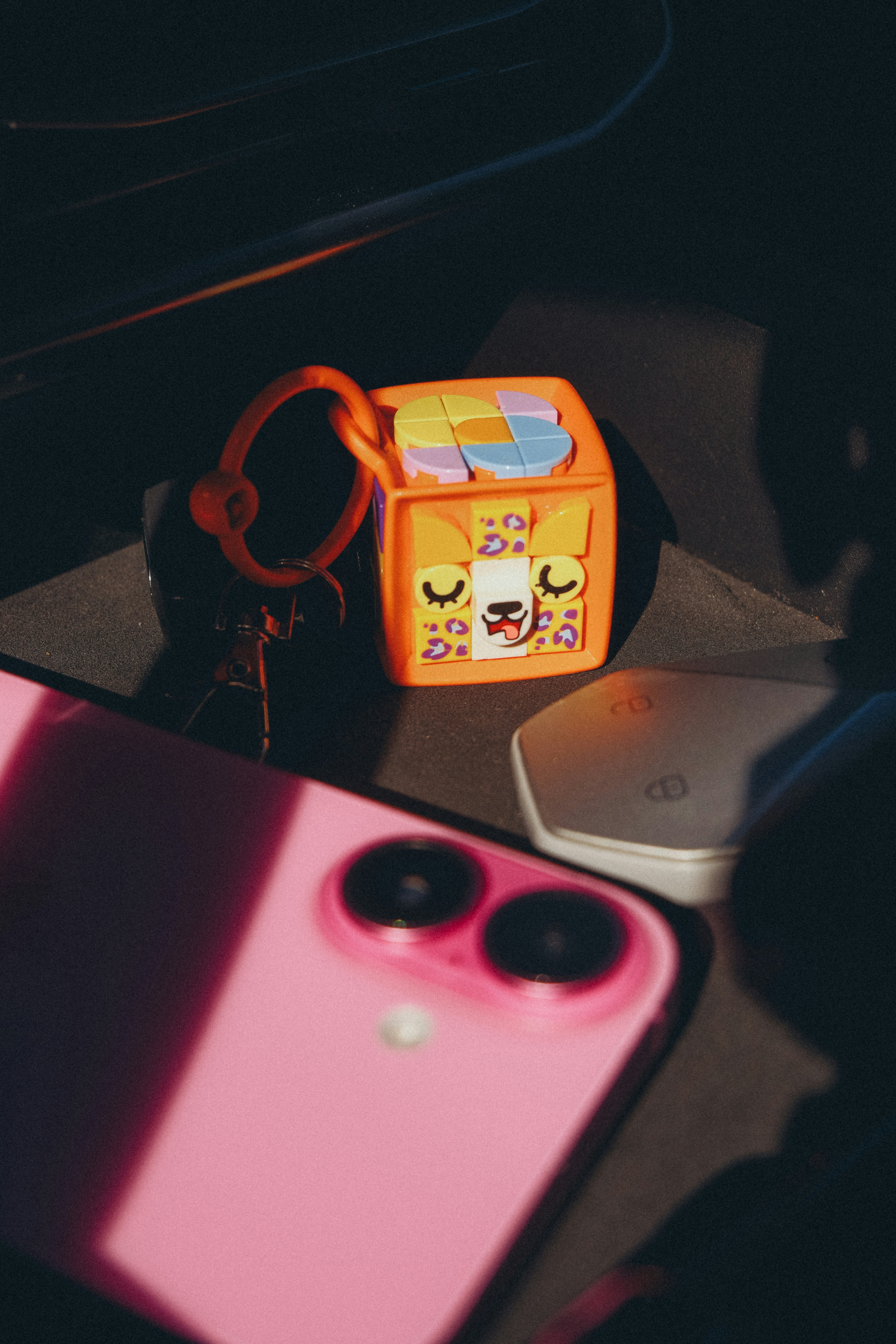 Candy-Cube Keychain: A Tiny Pop of Color Amid Tech in the Car Console