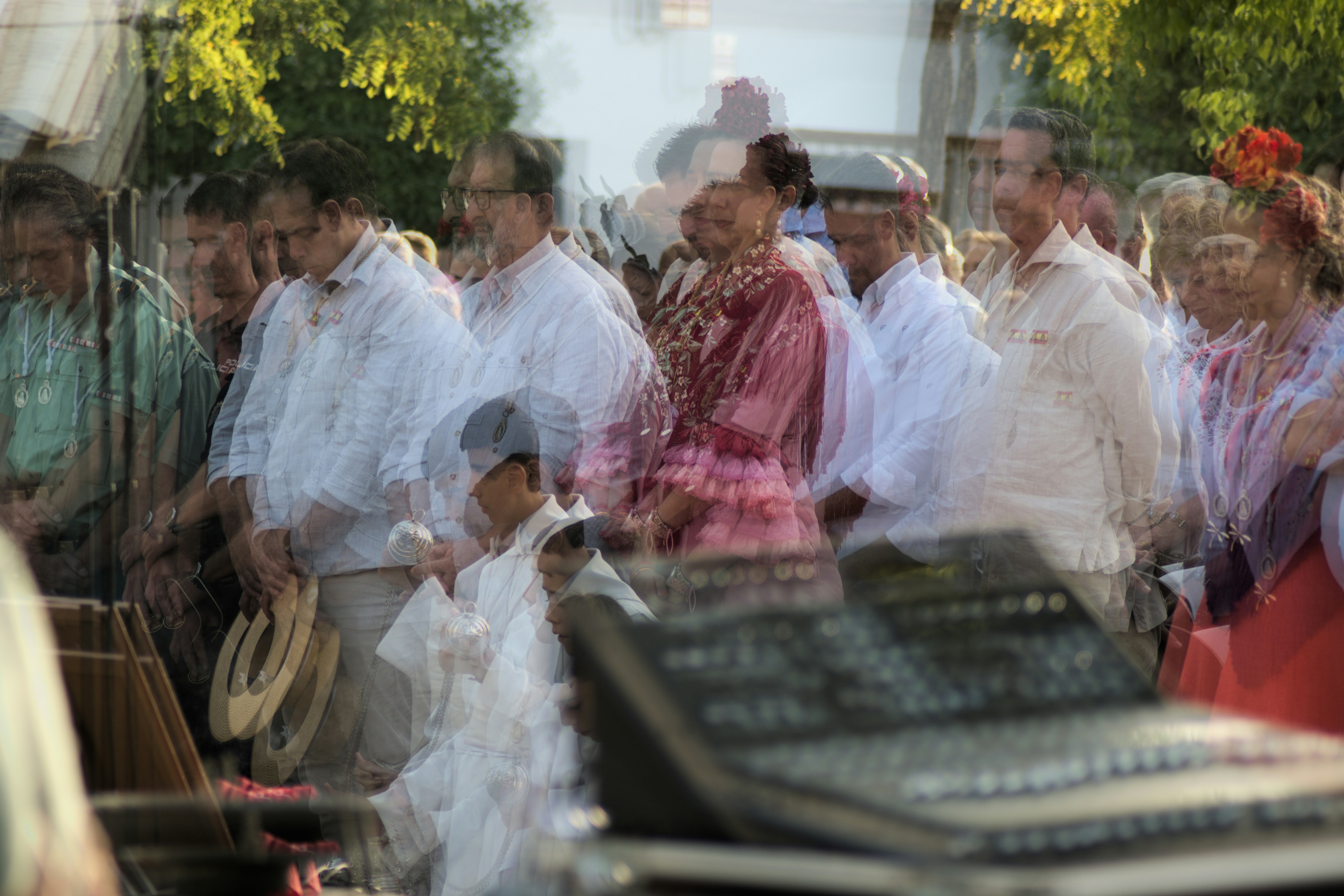 Reflections in the Atrium: A Multitude of Attendees Overlapped by Glass