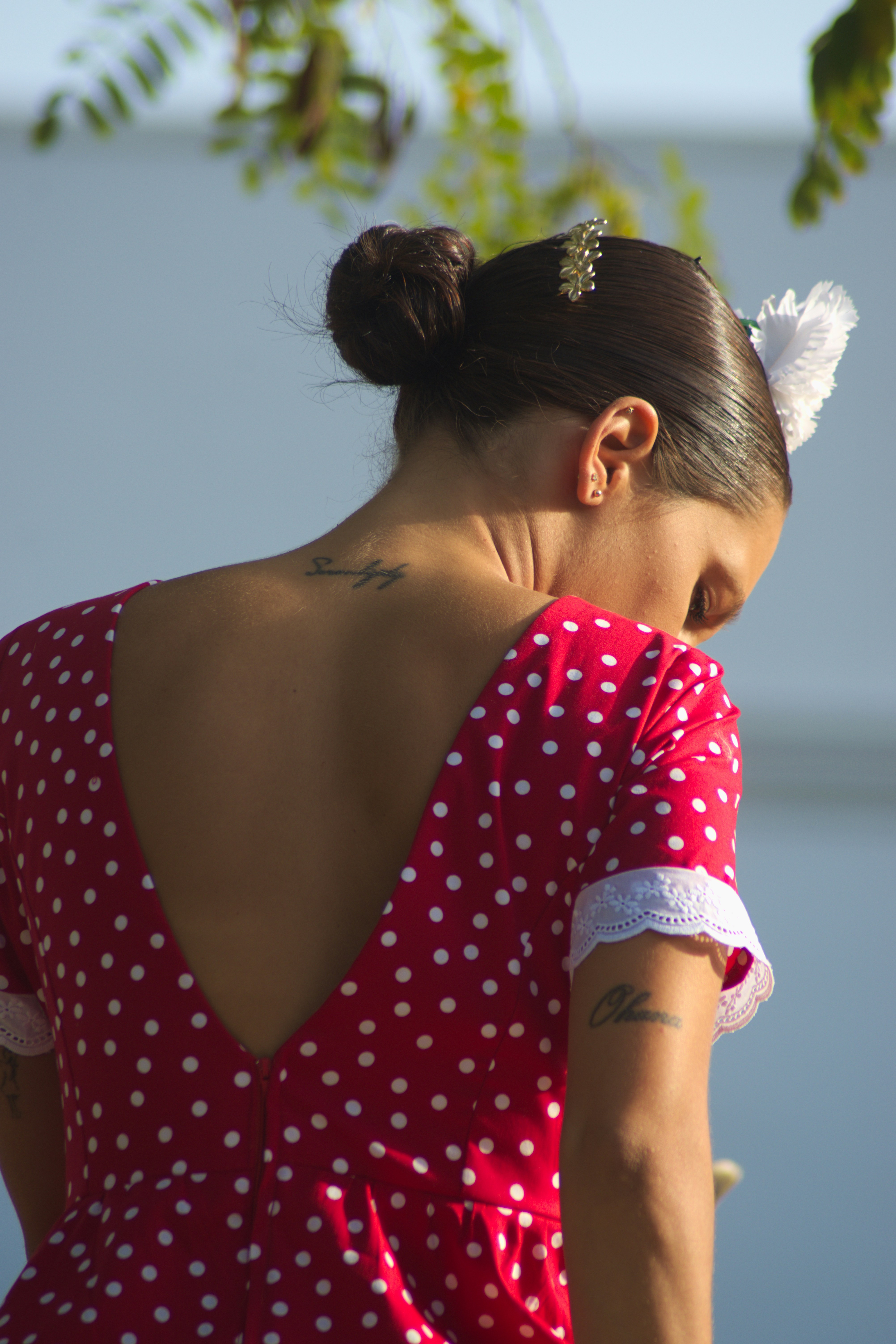 Back View in a Red Polka Dot Dress with Floral Hair Accessory