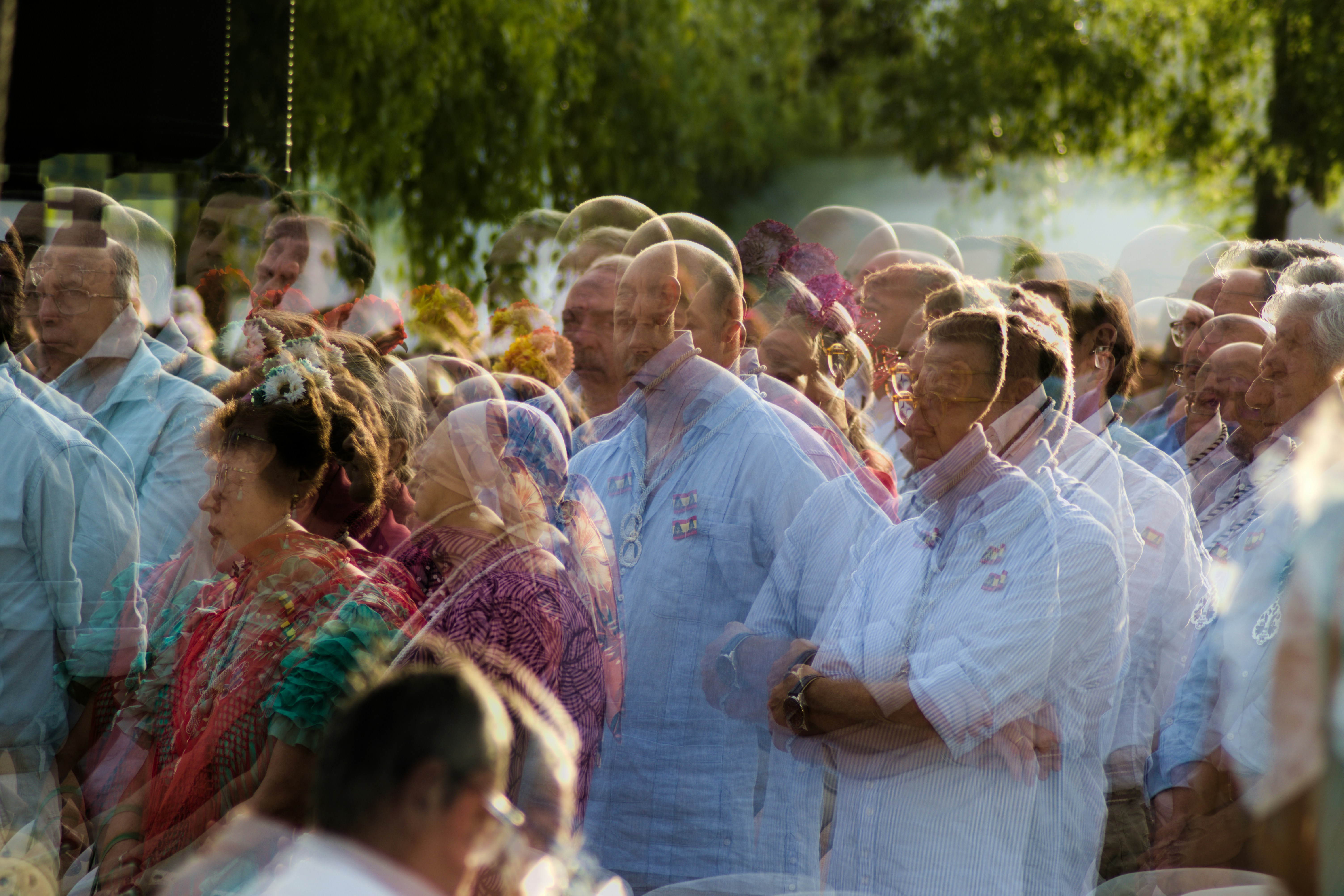 Crowd in Motion: Layered Faces and Sunlit Silhouettes