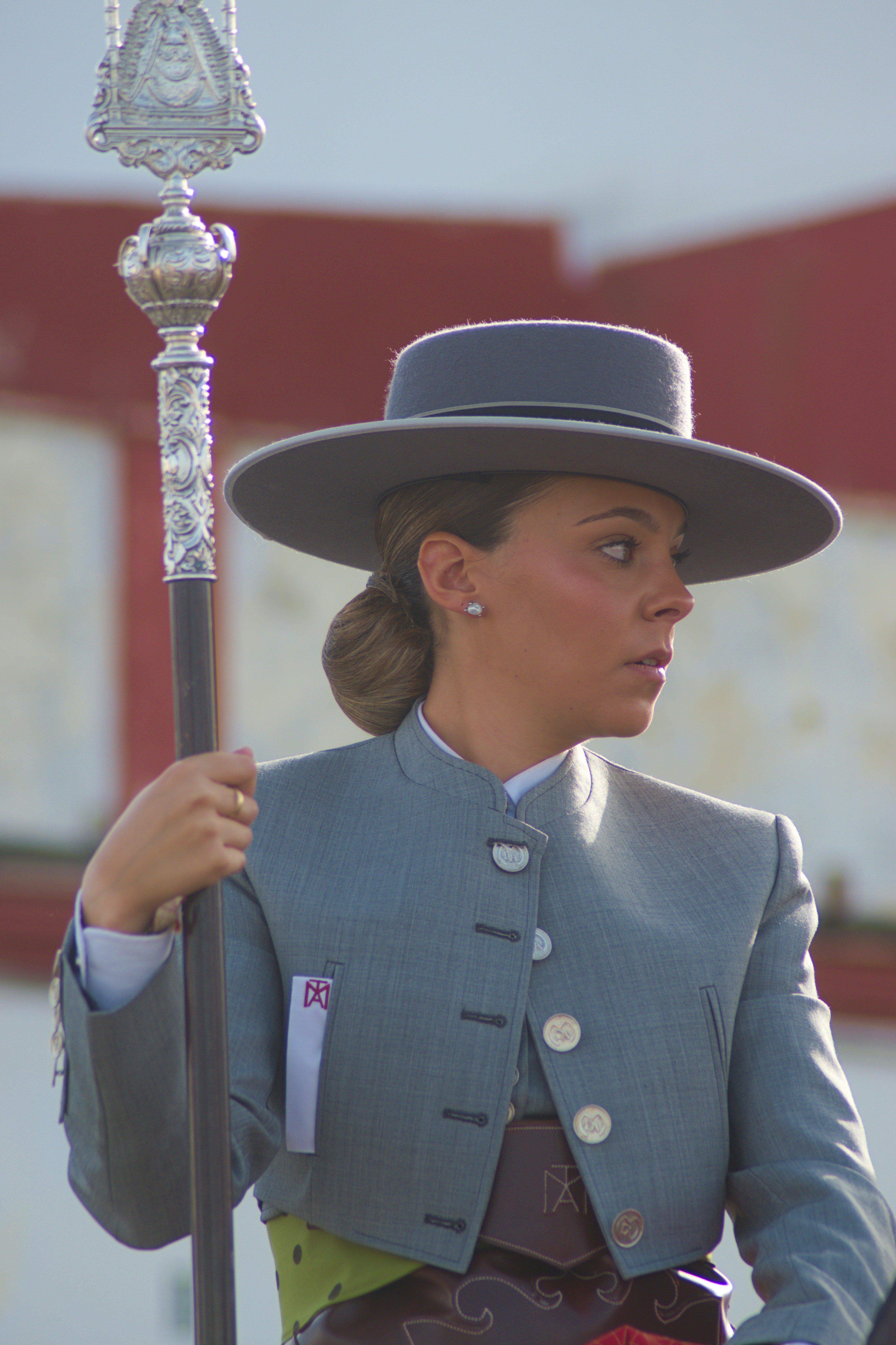  regalia in focus: a ceremonial stance with silver staff