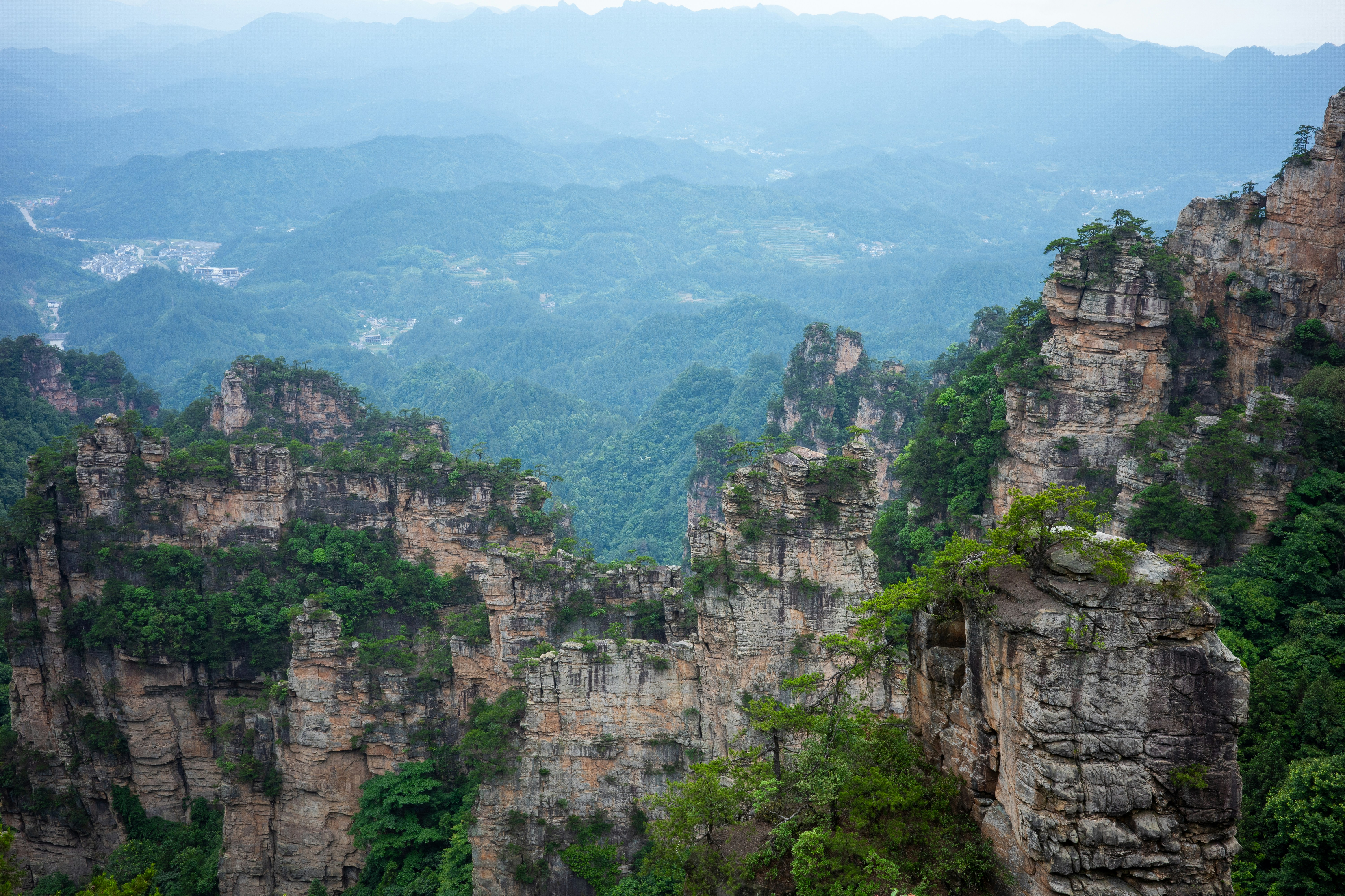 Stone Sentinels Over a Misty Valley
