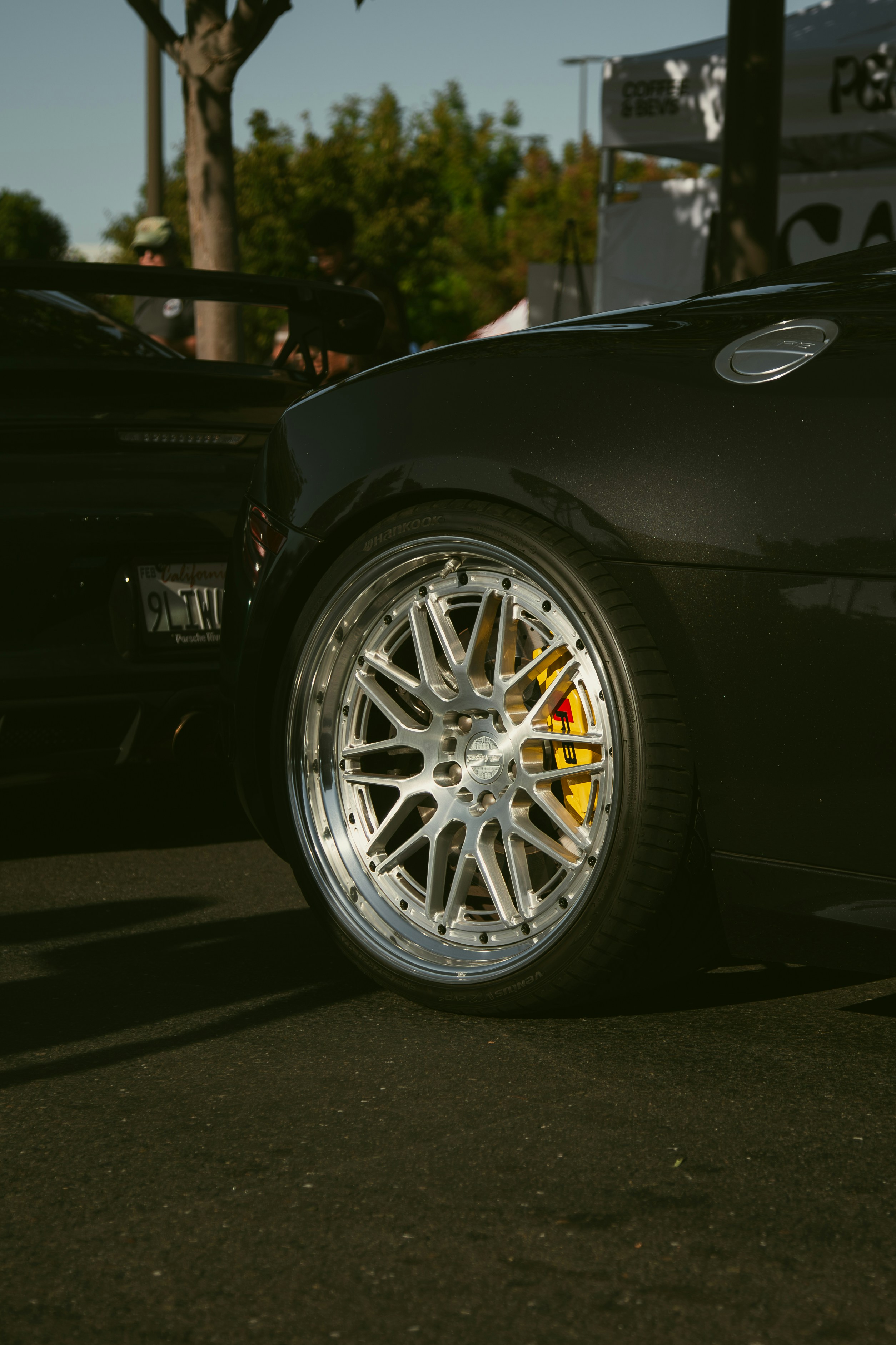 Shiny Lattice: A Chrome Wheel Illuminates a Low-Profile Night Drive