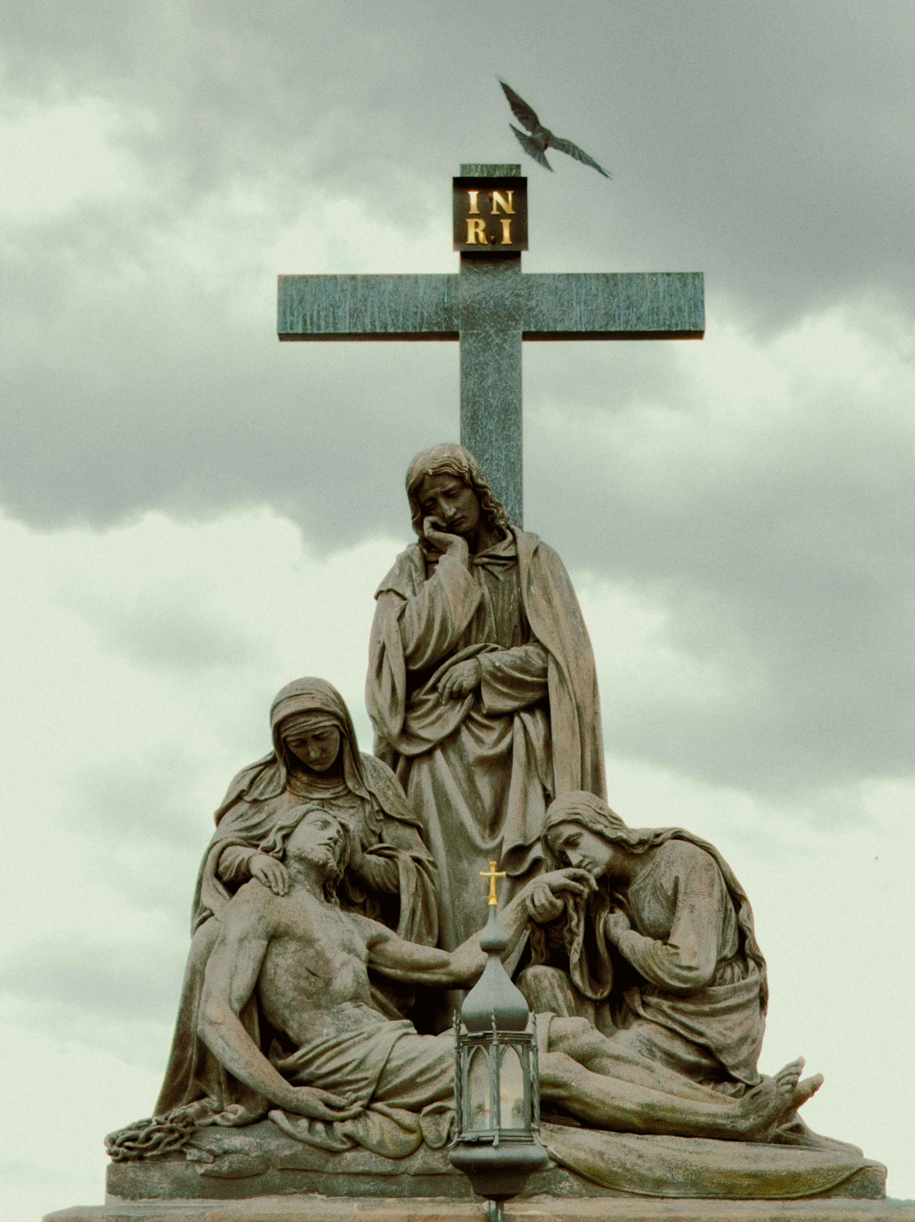 Cruciform Reverie: A Stone Tableau Beneath a Soaring Seabird