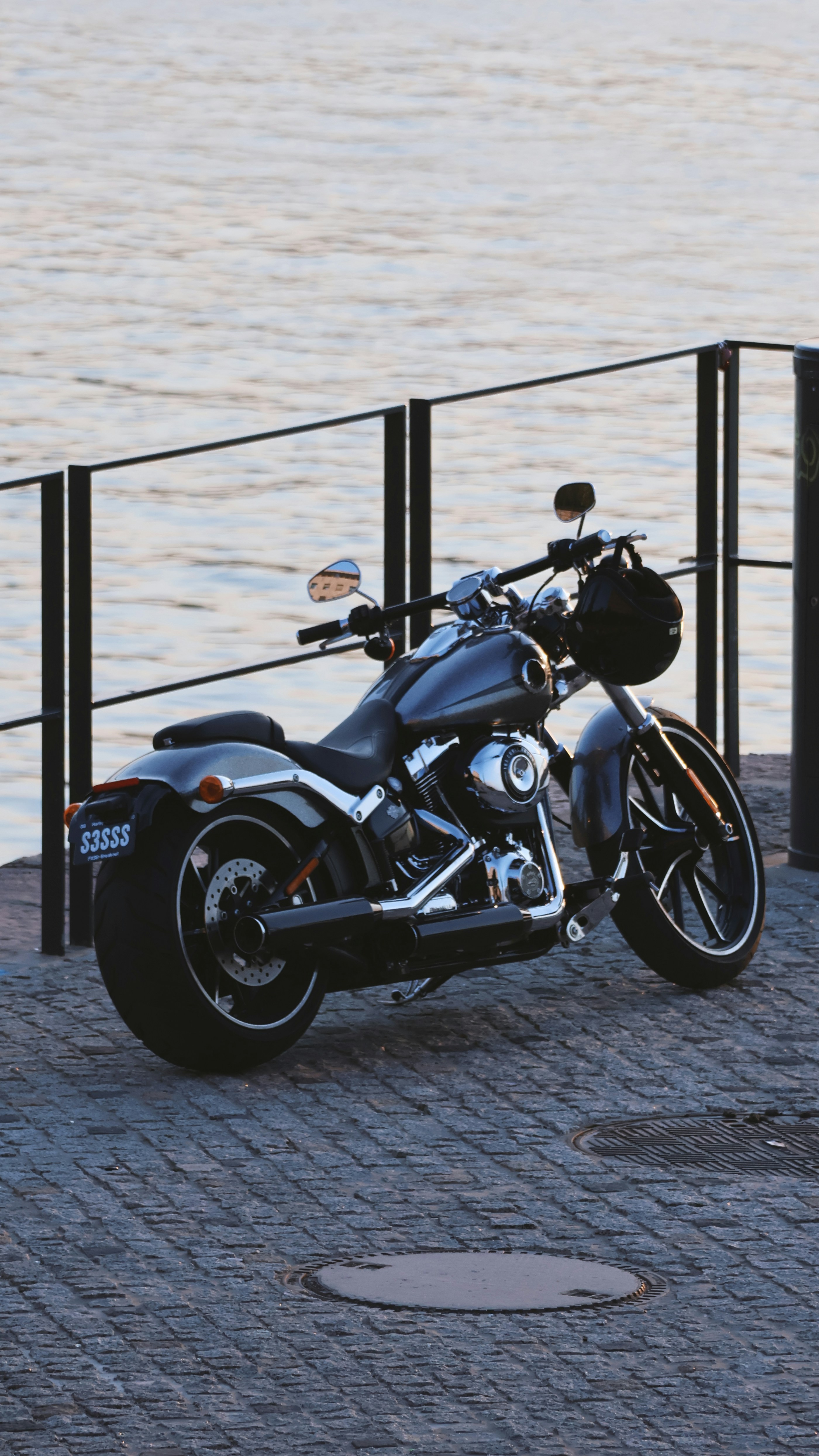 Low-angle harbor gaze: chrome and steel by the railing