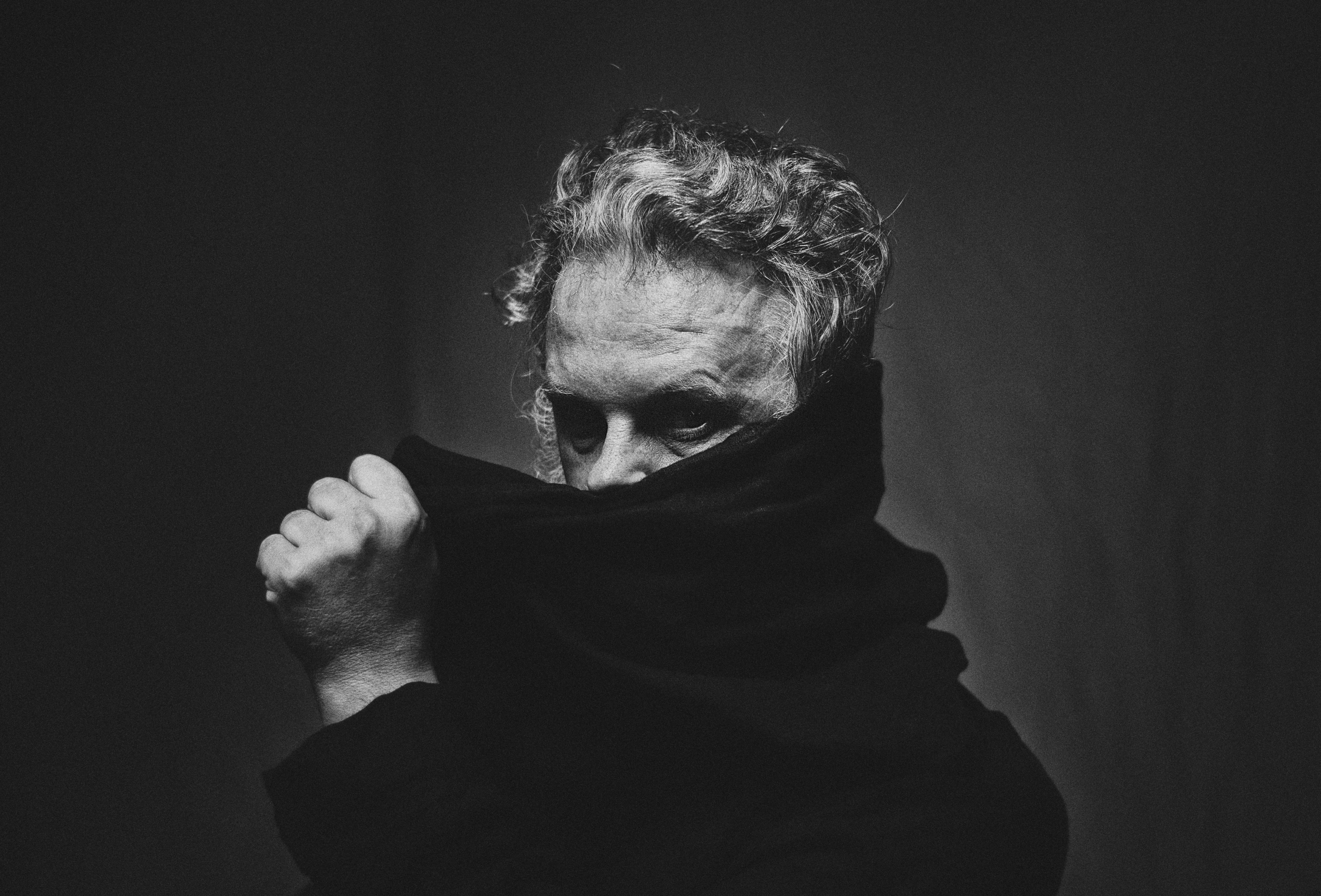 Veiled Gaze: A Quiet Portrait in Monochrome