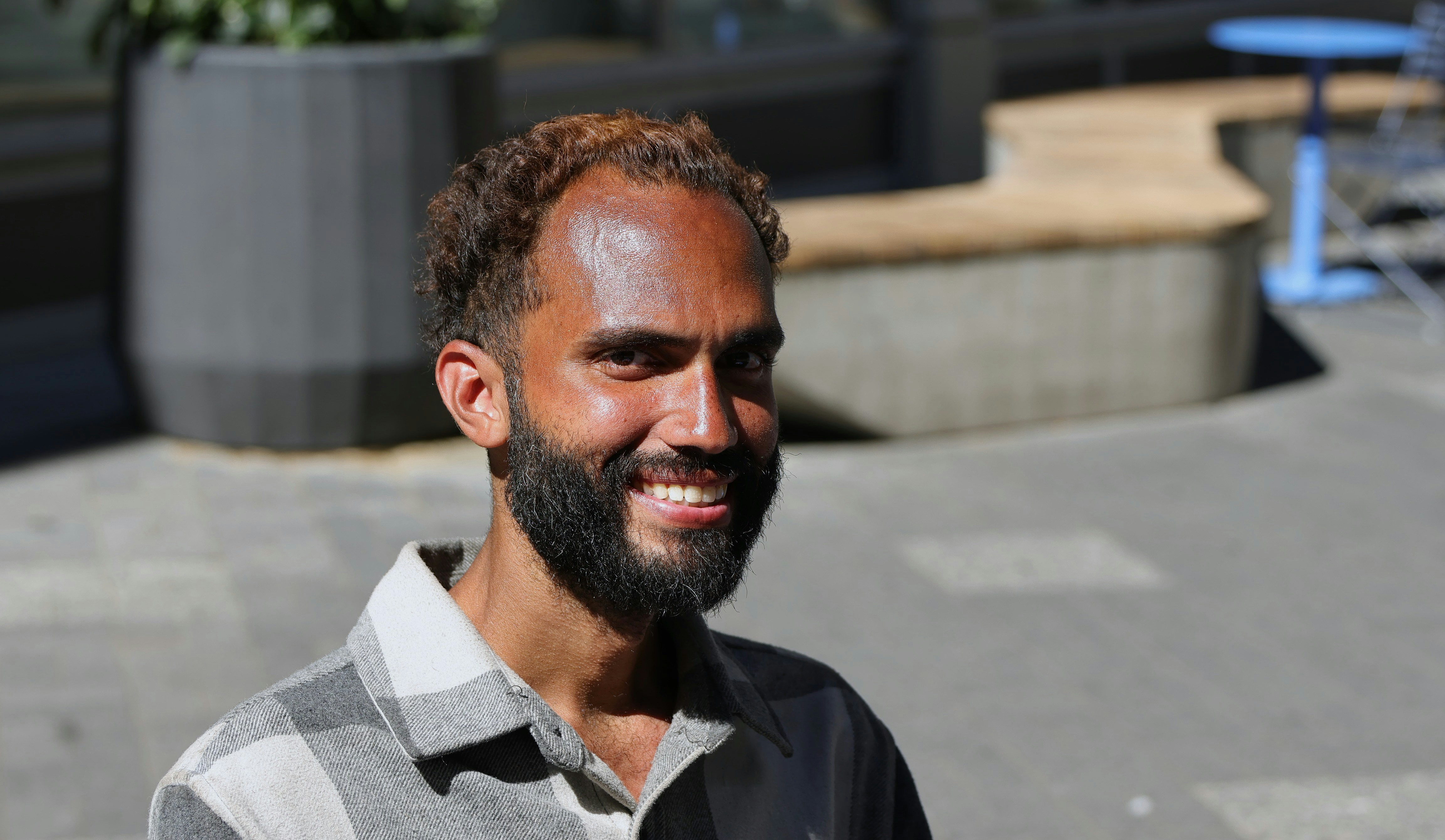 Portrait on a Sunny Plaza: Quiet Confidence Under Urban Light
