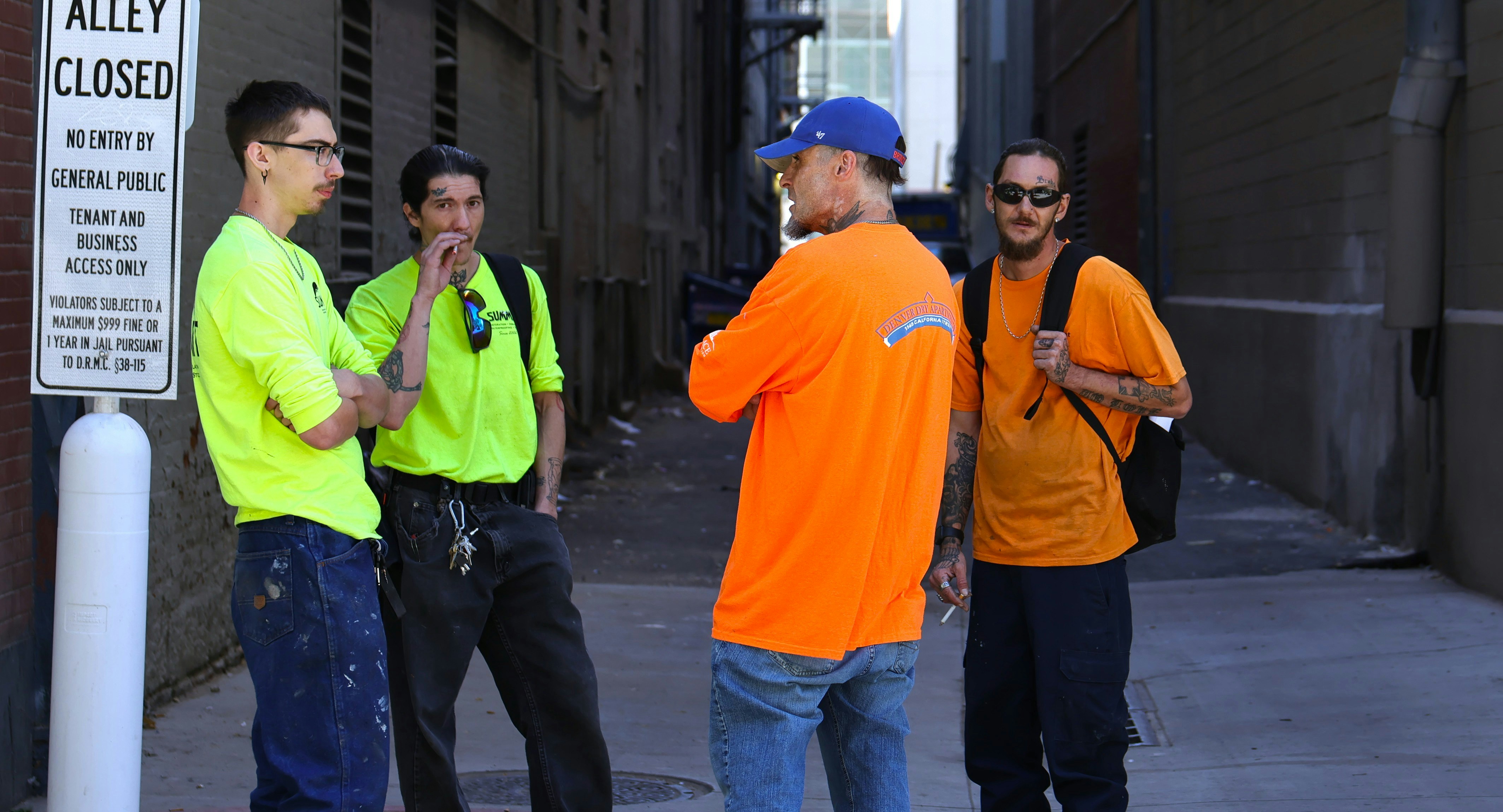 Neon Crew in an Alleyway: Briefing Under the Sign