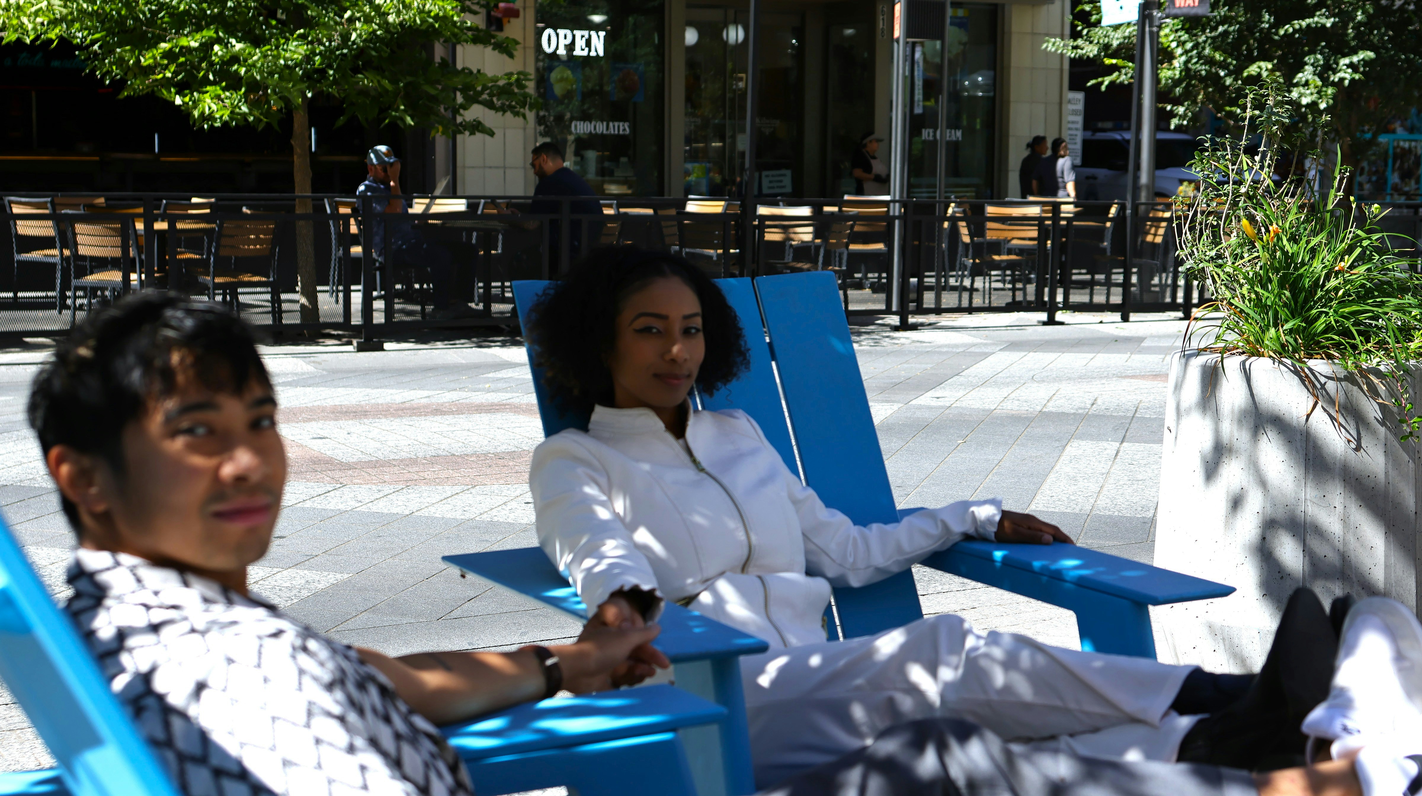 Blue Chairs, Quiet Power: A Moment of Pause in the Plaza