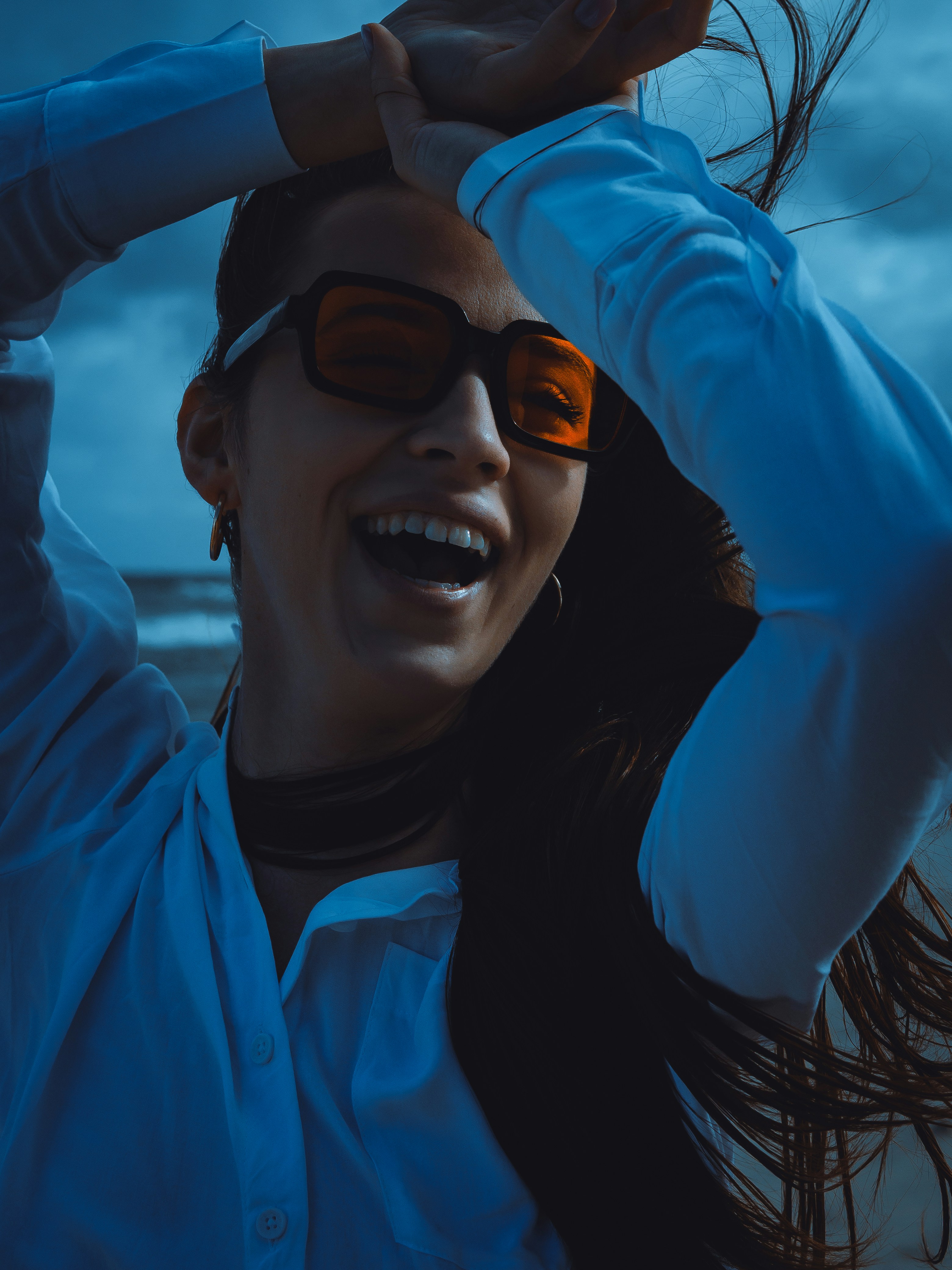 Joy in the Ocean Breeze: A Laughing Moment at Eye-Level